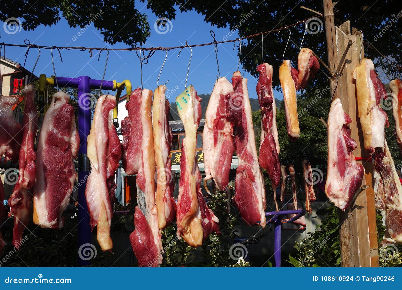 The Suspended Pieces of the Meat Drying Outside Stock Photo - Image of ...