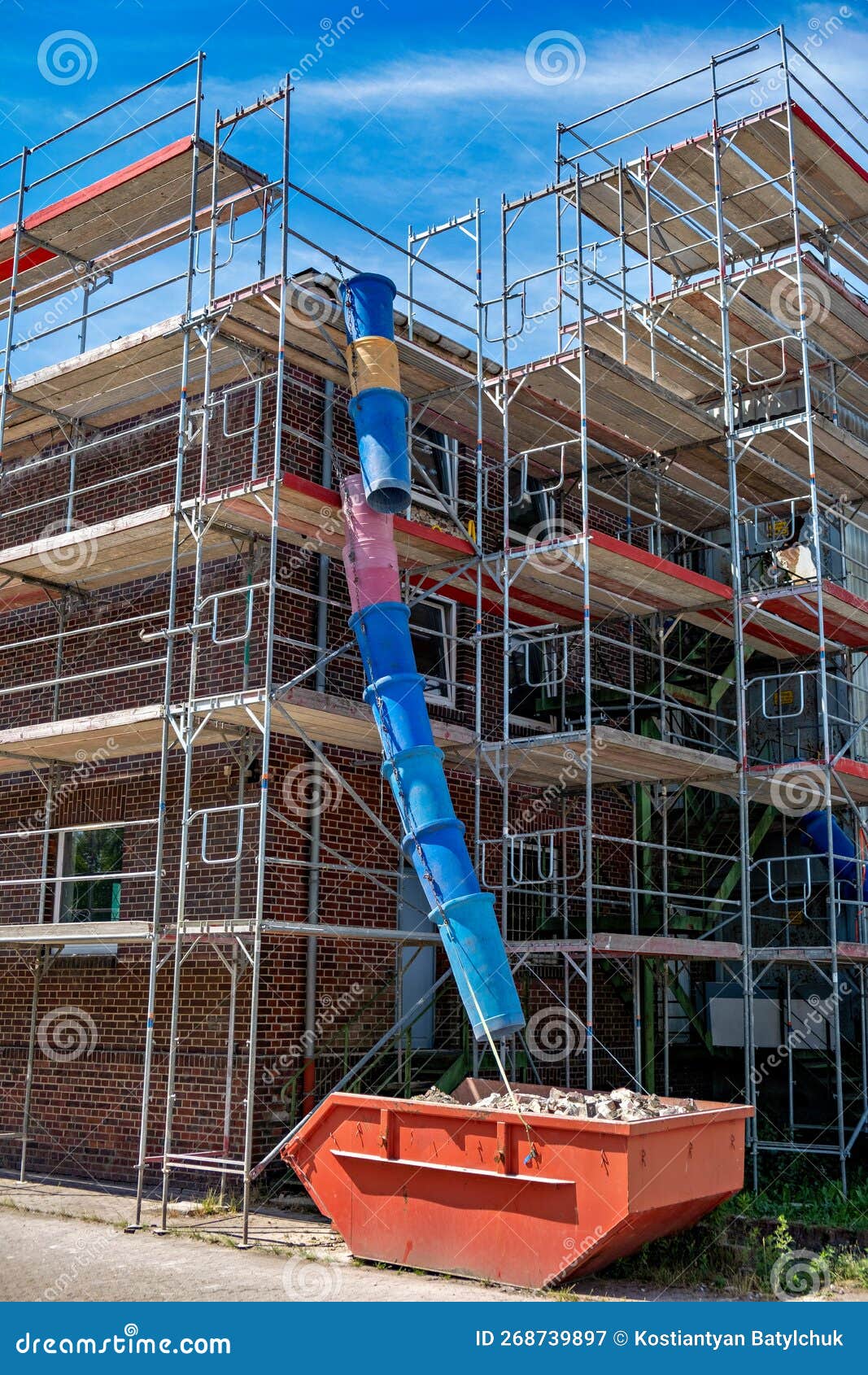Suspended Sections of Blue Construction Garbage Chute on a Building ...