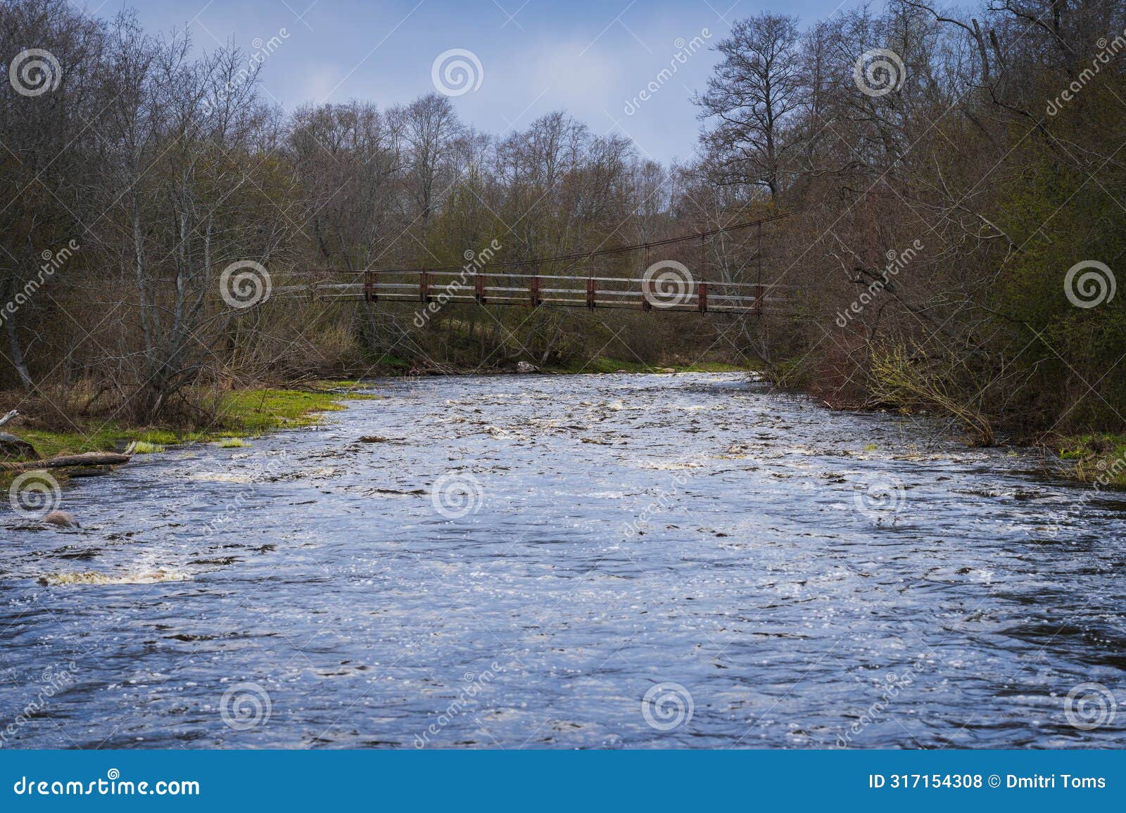 Suspension Bridge on the Fast-flowing Pirita River on a Cloudy Spring ...
