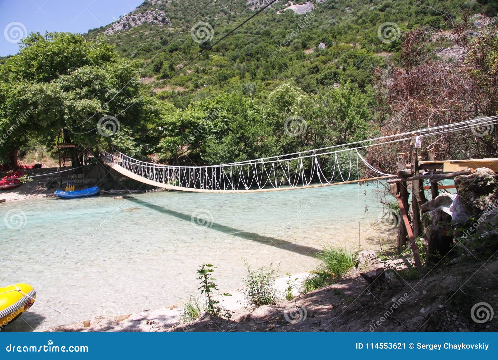 Suspension Bridge Over a Mountain Stream Stock Image - Image of green ...