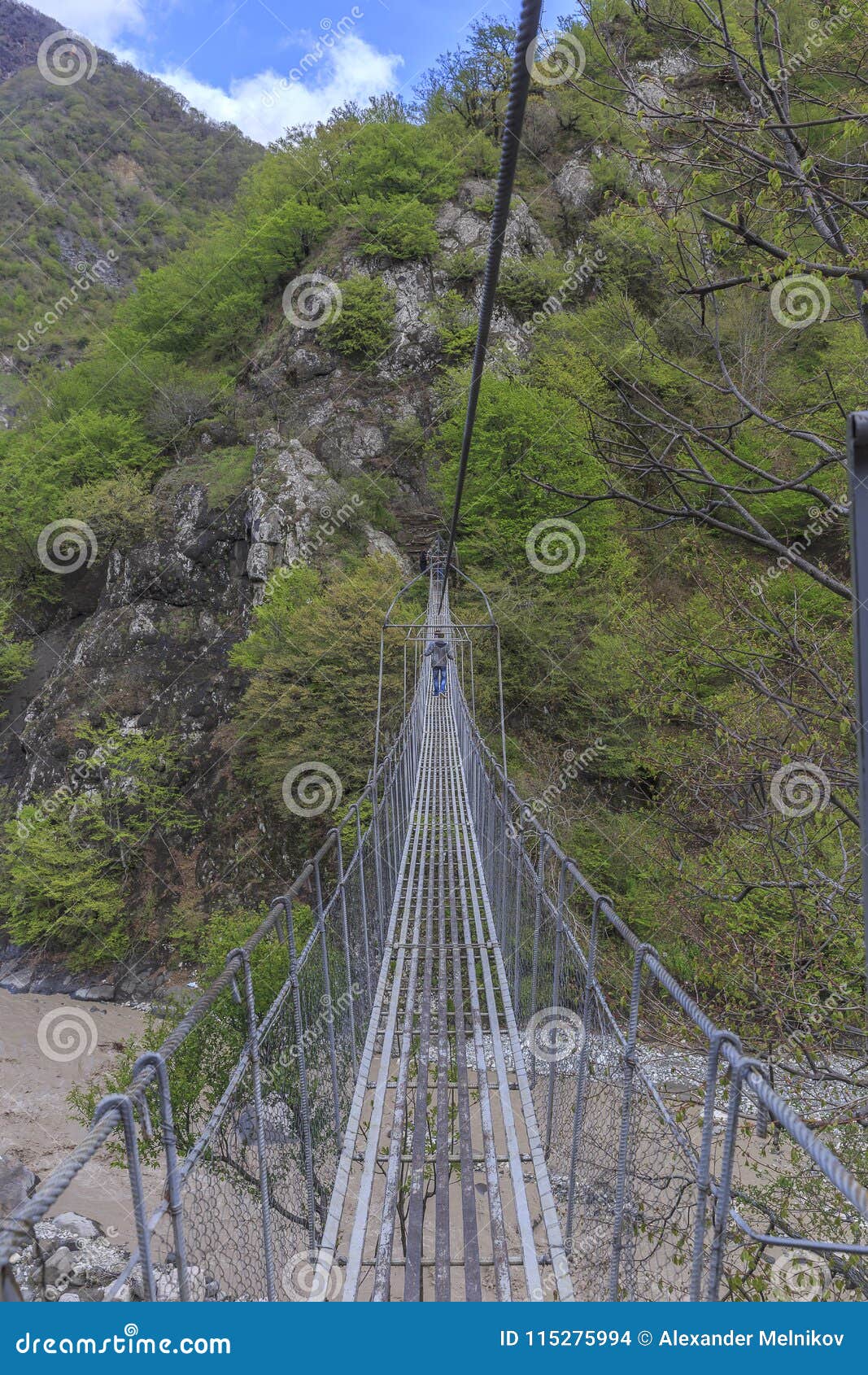 Suspension Bridge Over the River in the Mountains Stock Photo - Image ...