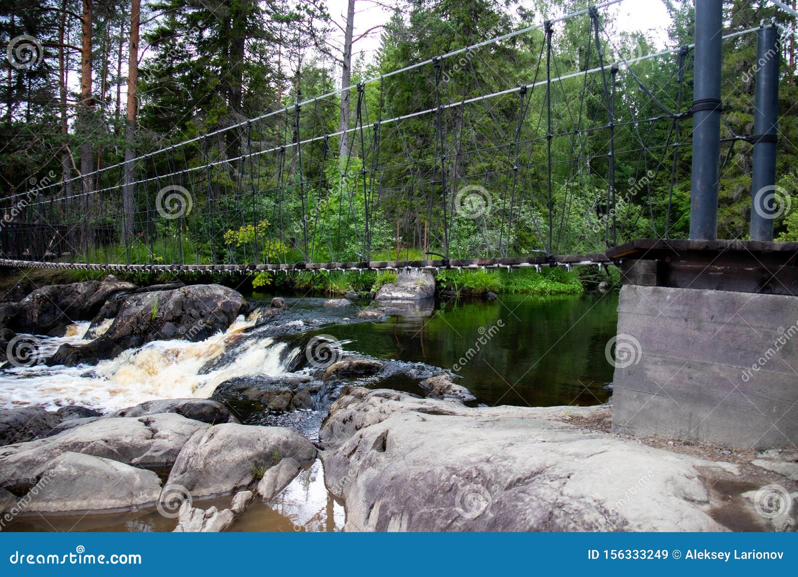 Suspension Bridge Over a Small Waterfall Stock Image - Image of scenic ...