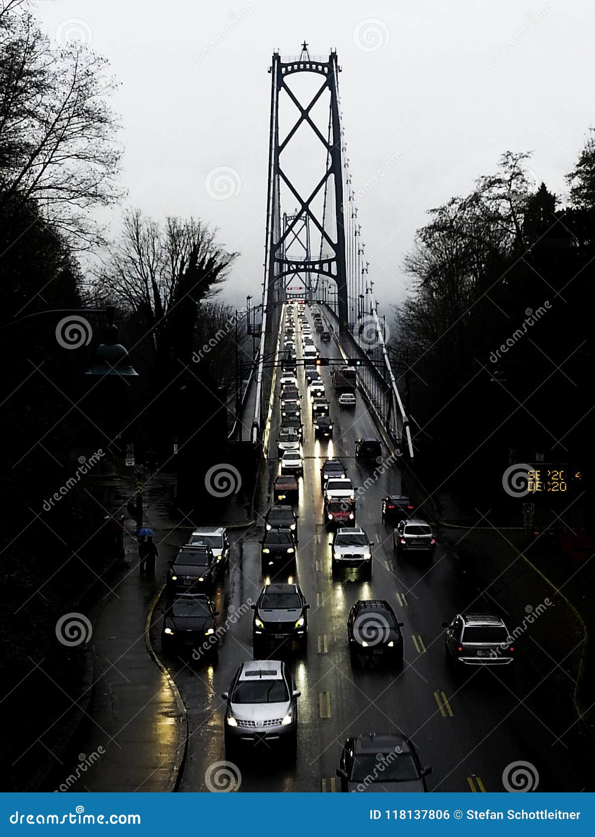 A Suspension Bridge at the Sunset with Cars Stock Photo - Image of dock ...