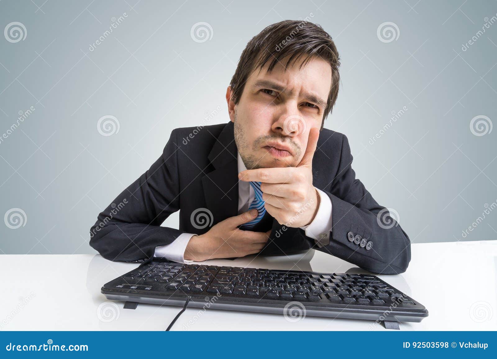 Suspicious Businessman is Looking at Screen at Work Stock Photo - Image ...