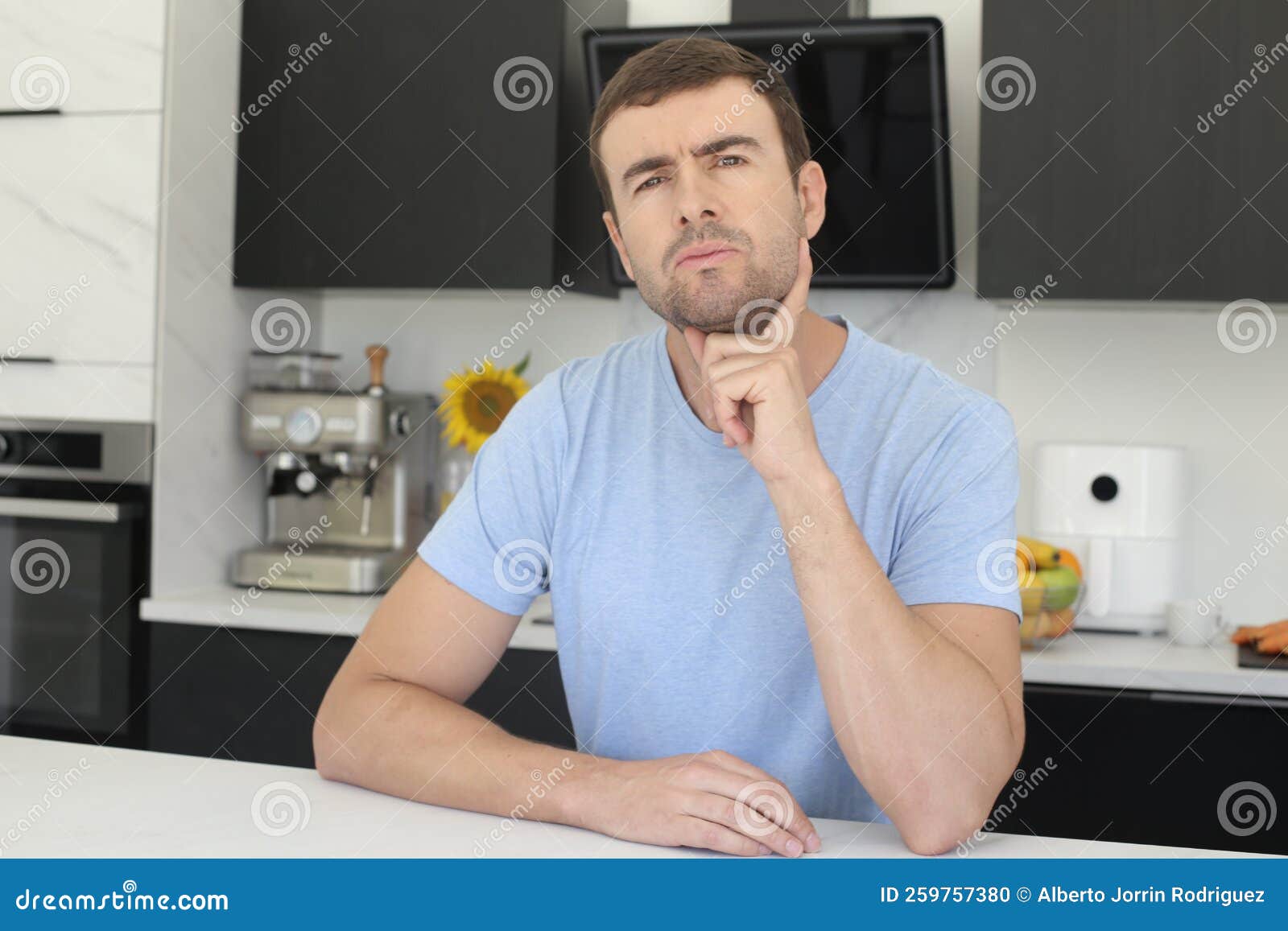 Suspicious Looking Man Thinking in the Kitchen Stock Photo - Image of ...