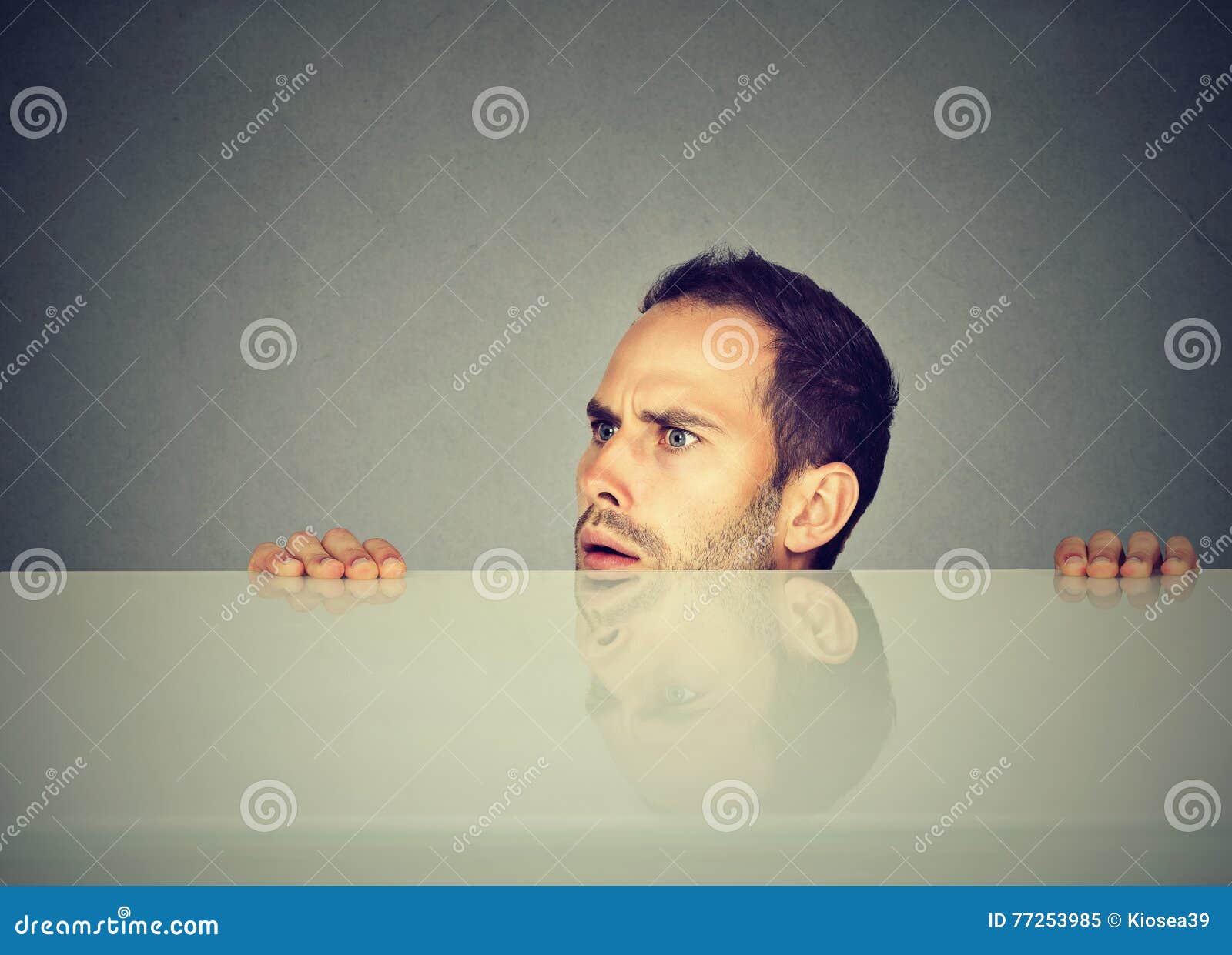 Suspicious Man Peeking from Under Table Stock Image - Image of ...