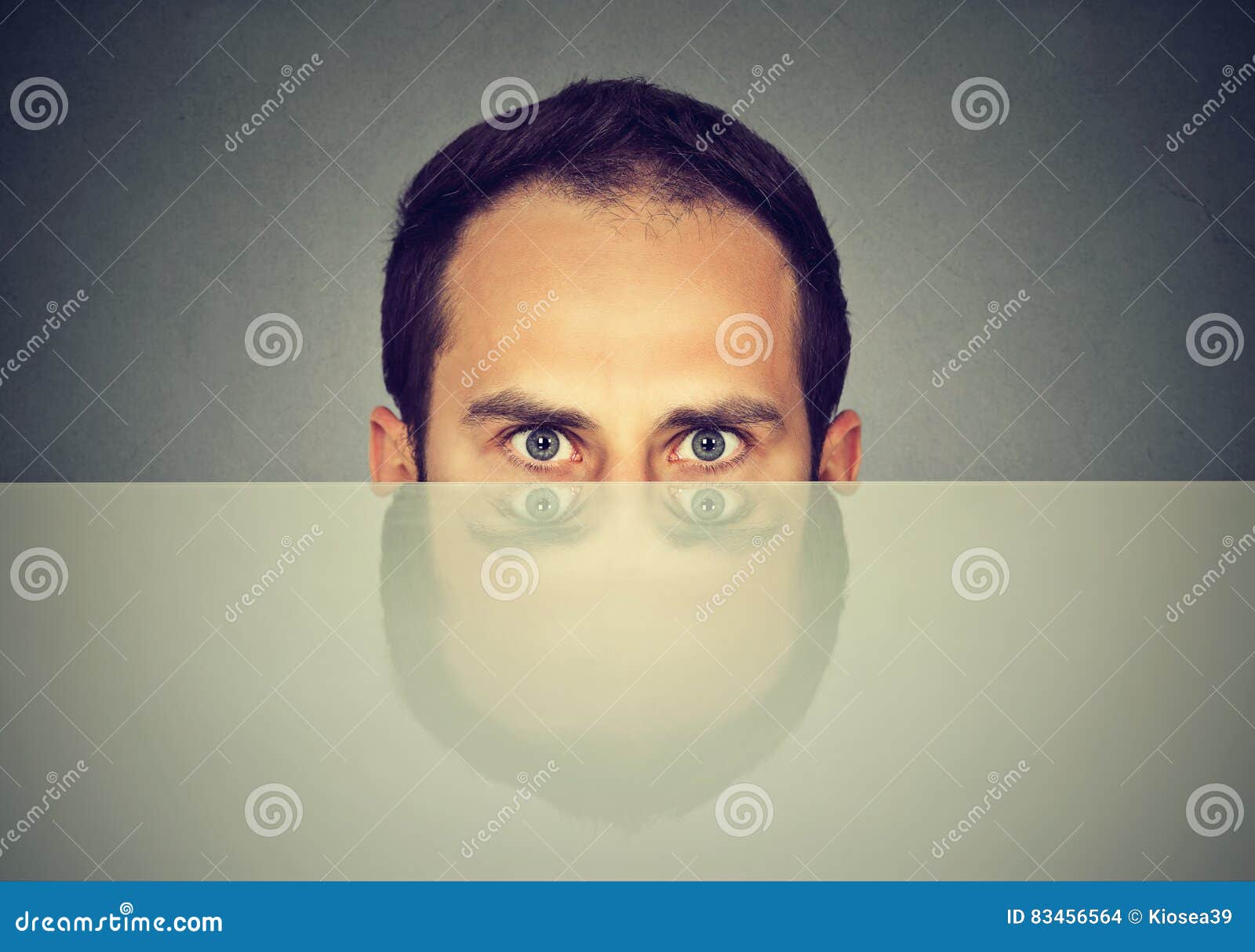 Suspicious Scared Man Peeking from Under the Table Hiding Stock Photo ...