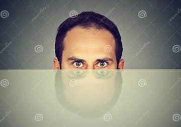 Suspicious Scared Man Peeking from Under the Table Hiding Stock Photo ...