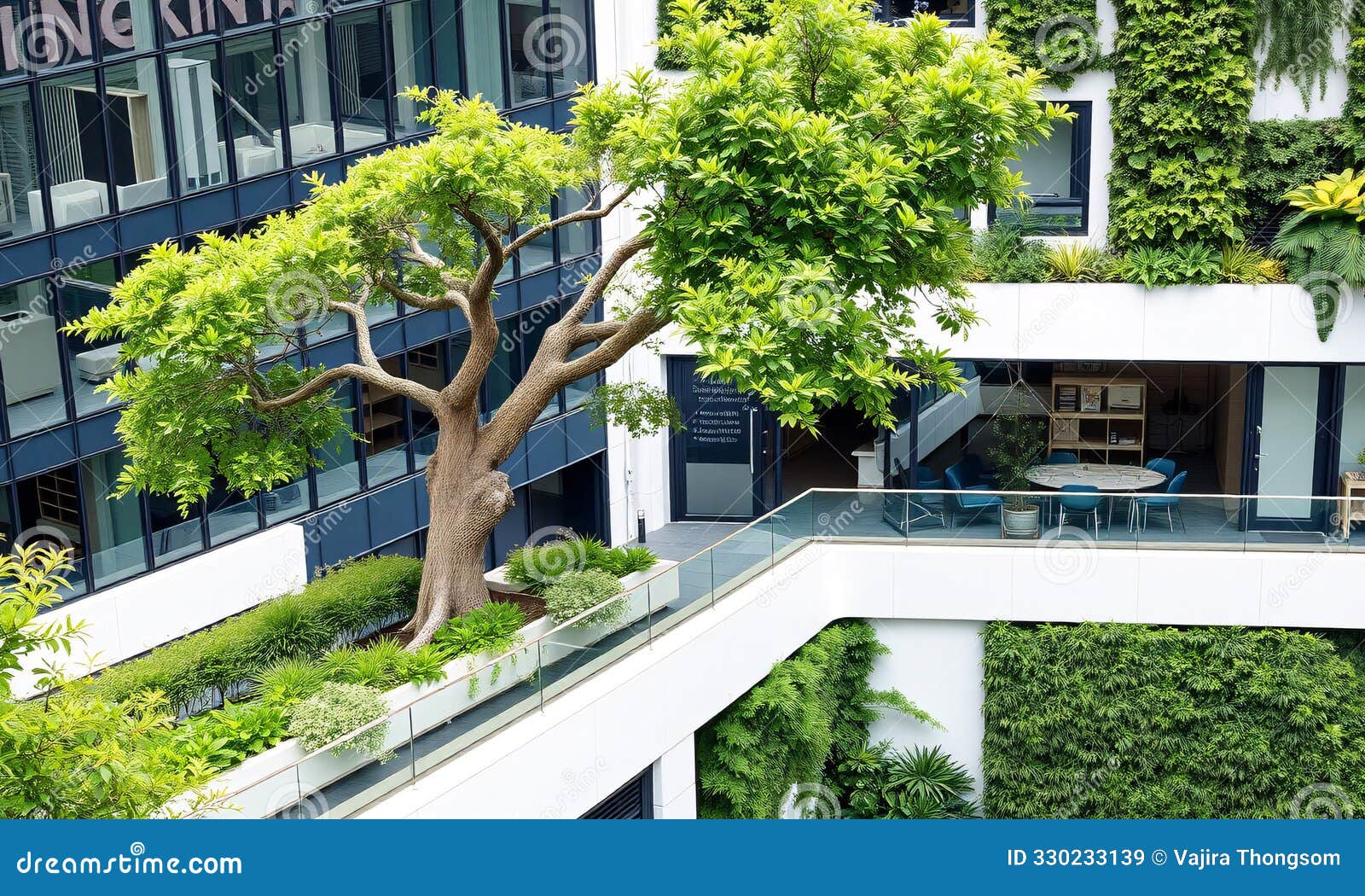 Sustainable Office Building with a Striking Tree Growing through a ...
