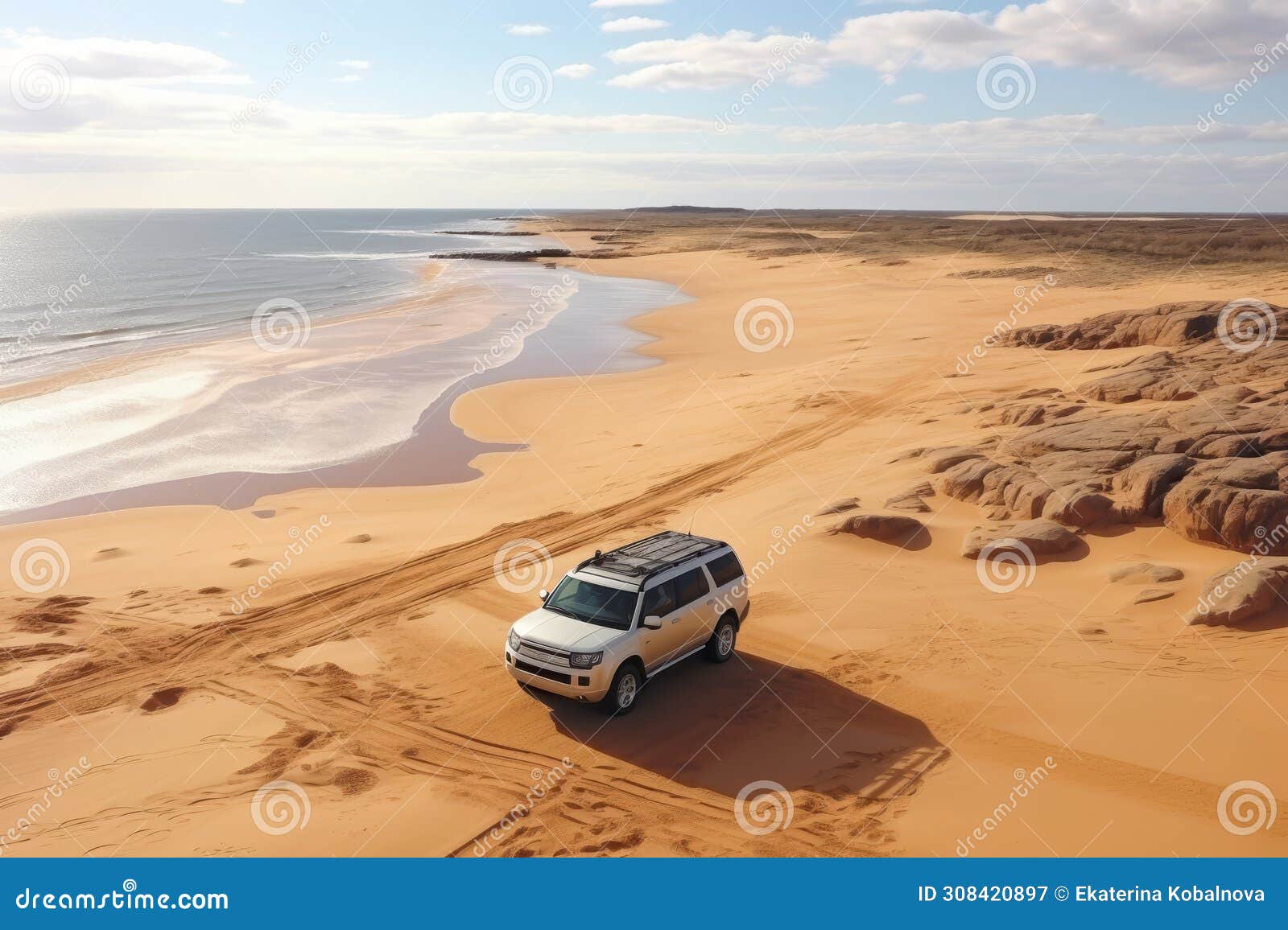 The SUV Car Rides on the Sands of the Seashore, Aerial View Stock ...