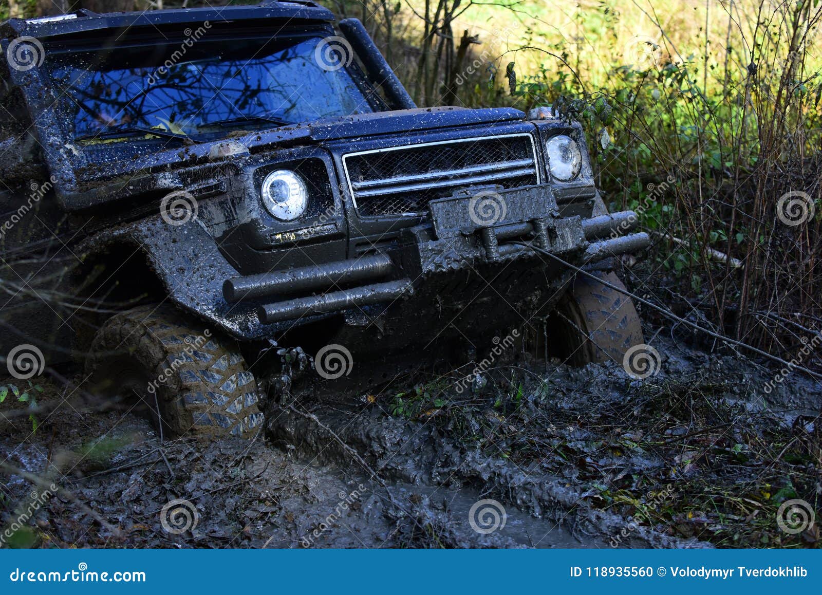 SUV is Pulled Out from Puddle of Mud Stock Photo - Image of background ...