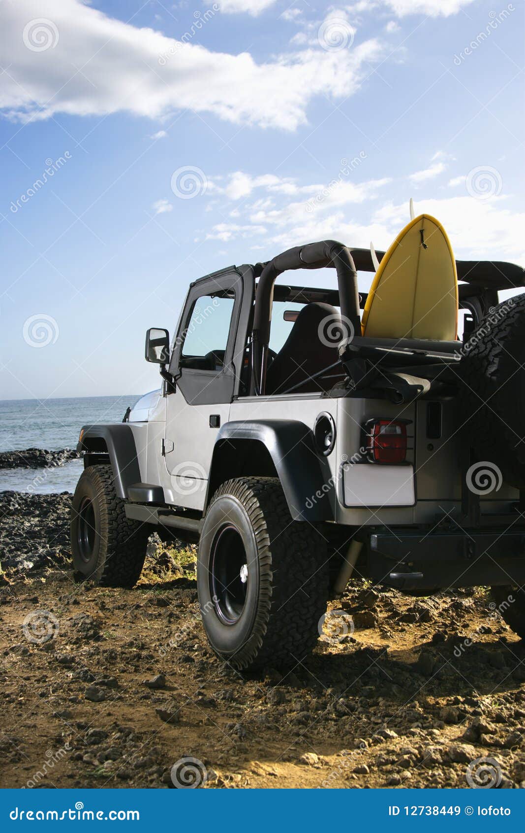 SUV and Surfboard at the Beach Stock Image - Image of rocky, shadows ...