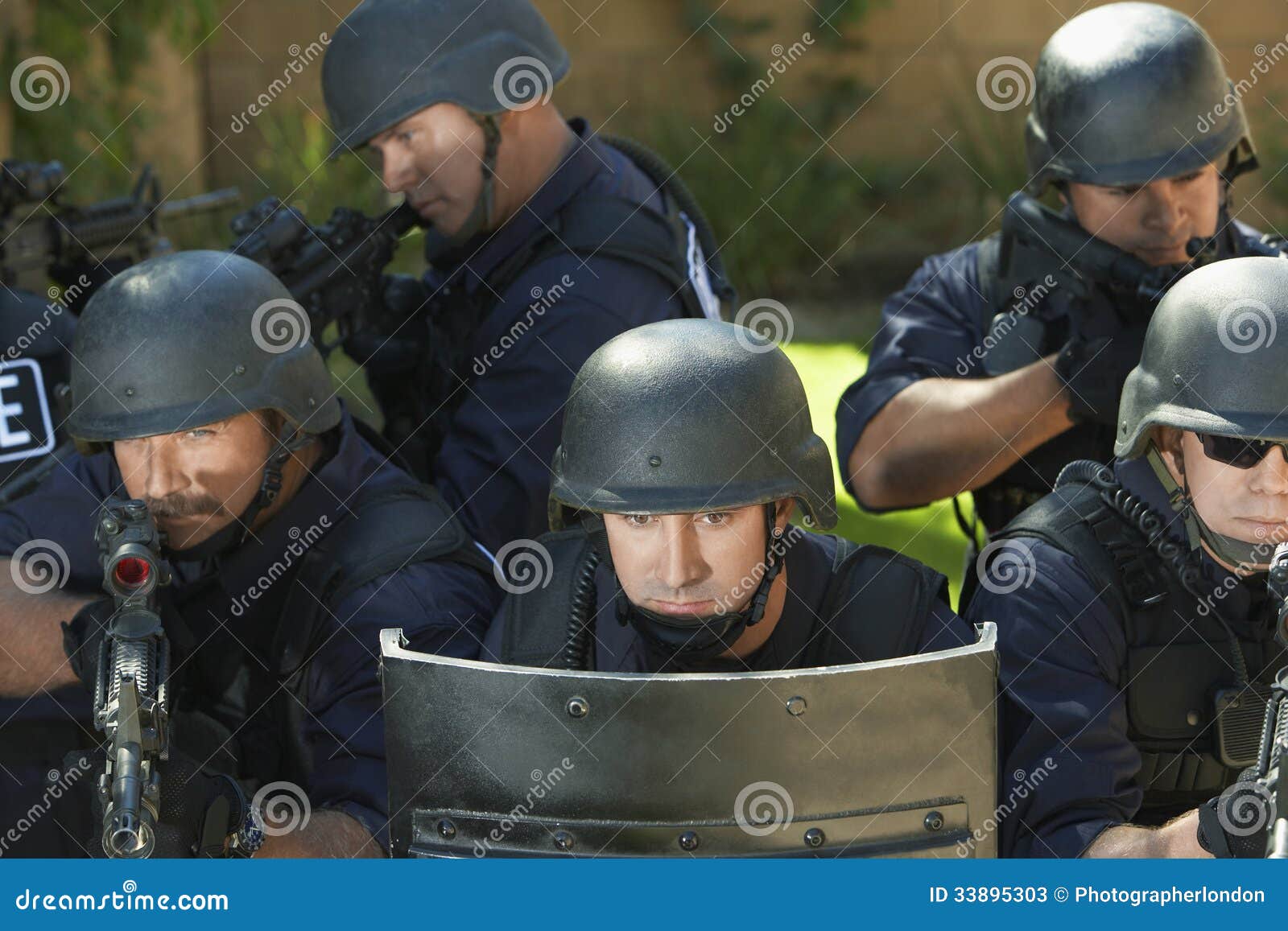 Swat Officers Aiming with Gun Behind Shield Stock Image - Image of ...