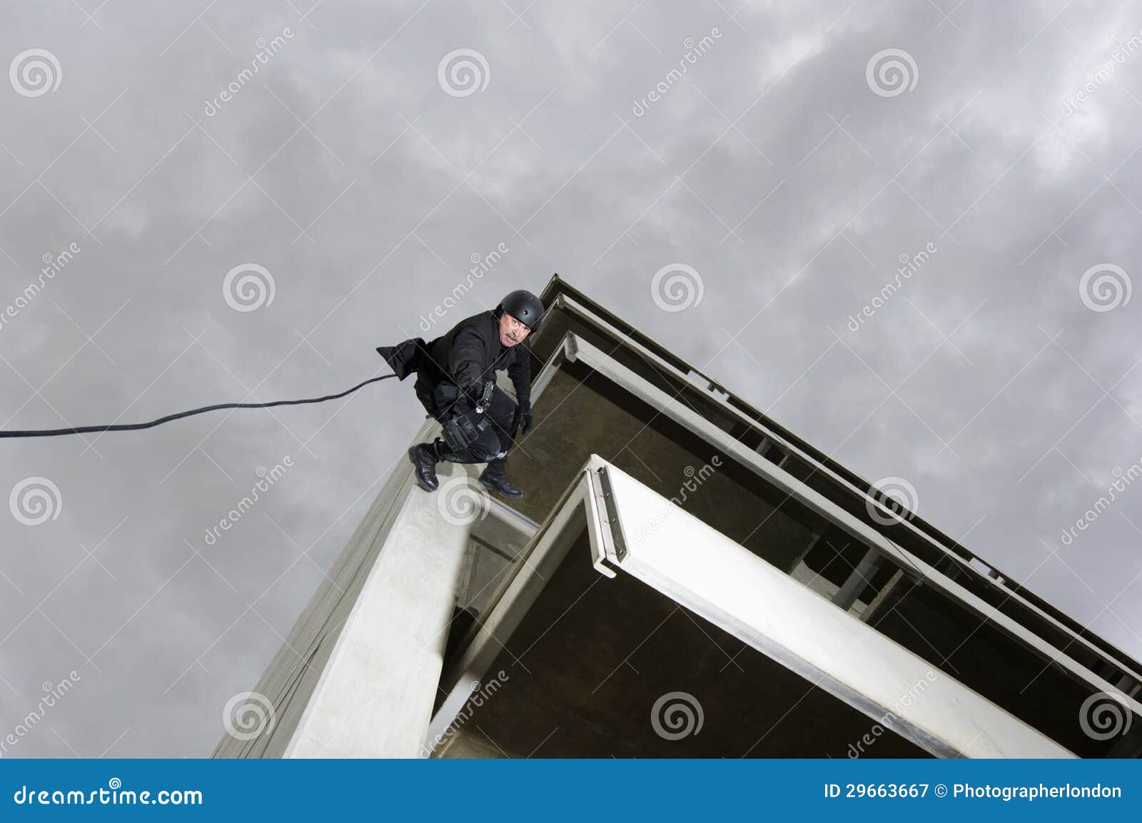SWAT Team Officer Rappelling and Aiming Gun Stock Image - Image of ...