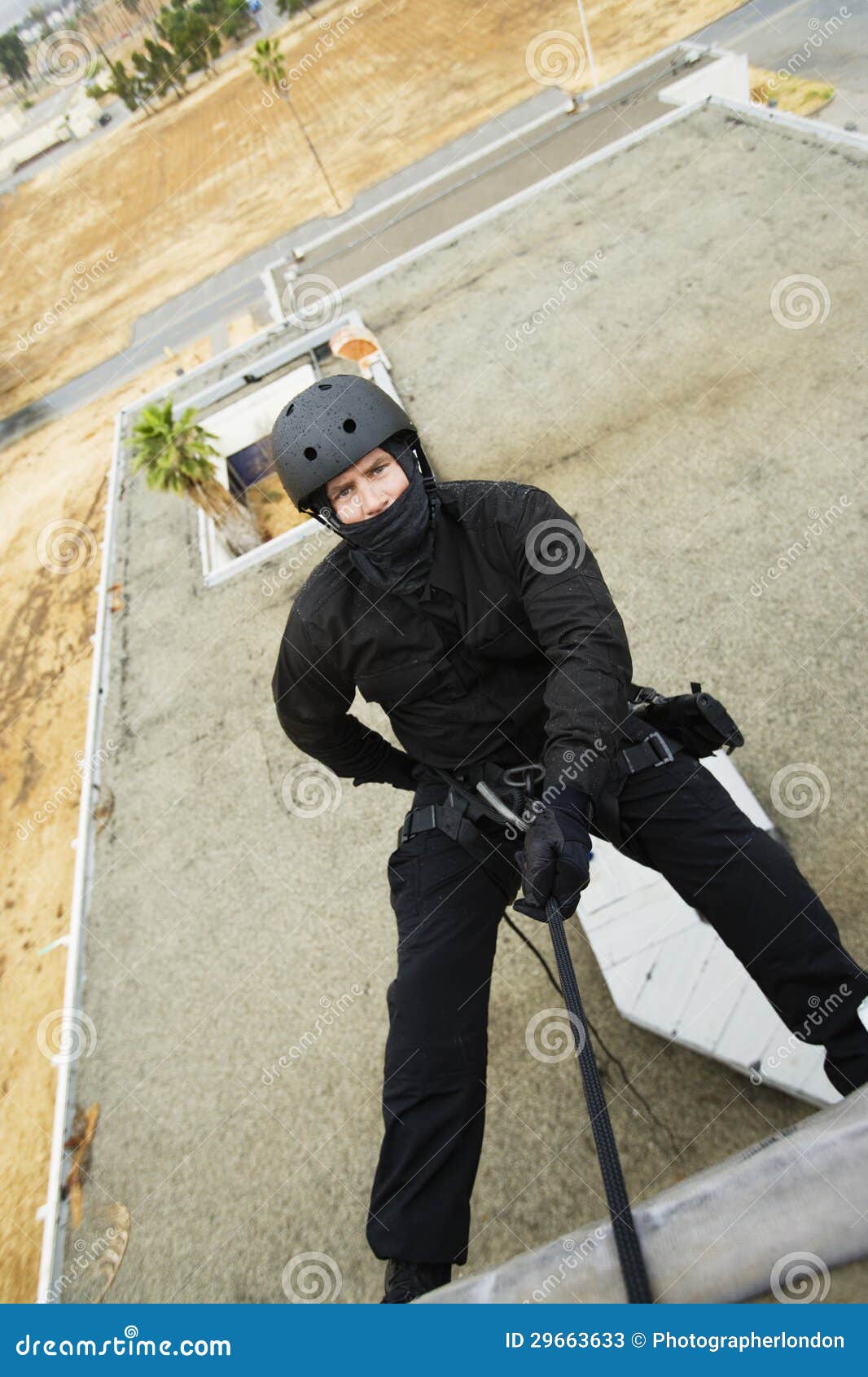 SWAT Team Officer Rappelling from Building Stock Image - Image of black ...