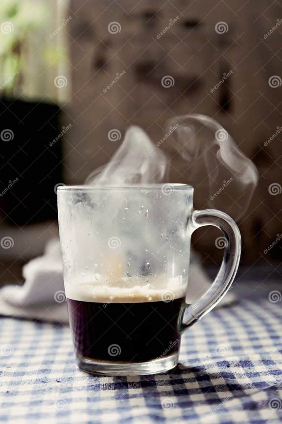 Sweating Cup of Coffee with Steam on the Table Stock Image - Image of ...