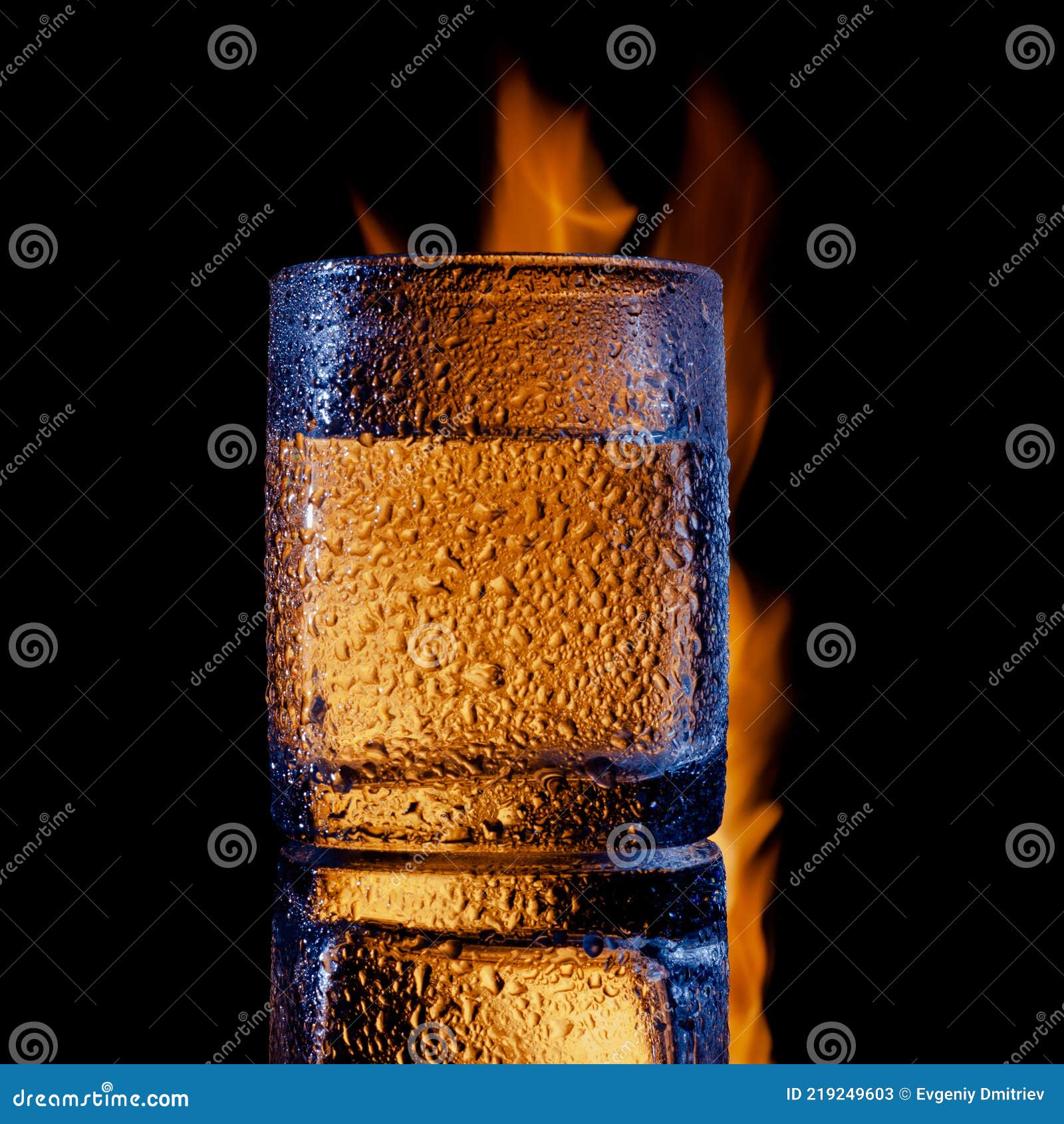 Sweating Glass of Water on Fire on a Black Background Stock Image ...