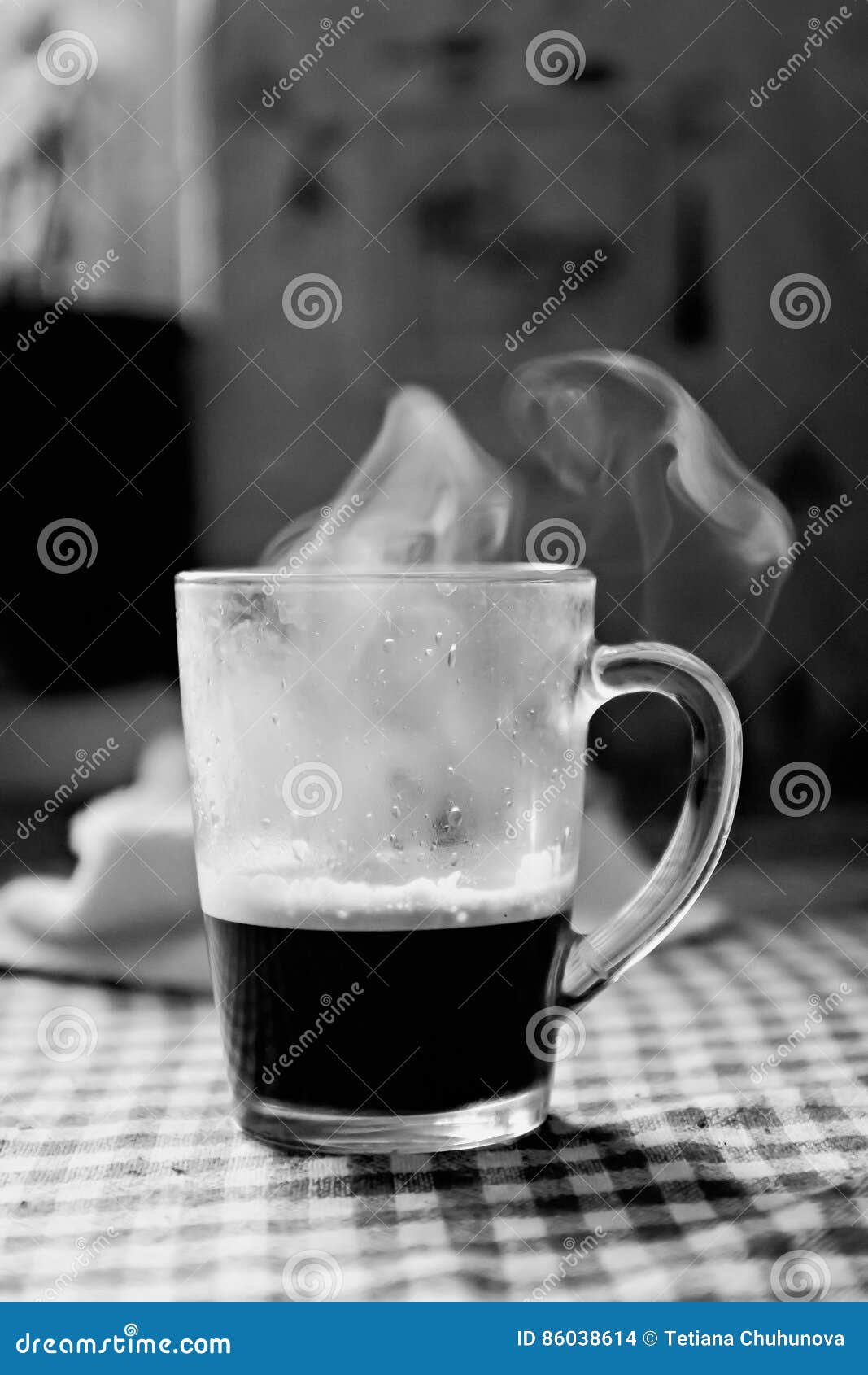 Sweating with Steam Cup of Coffee on a Black and White Table Stock ...