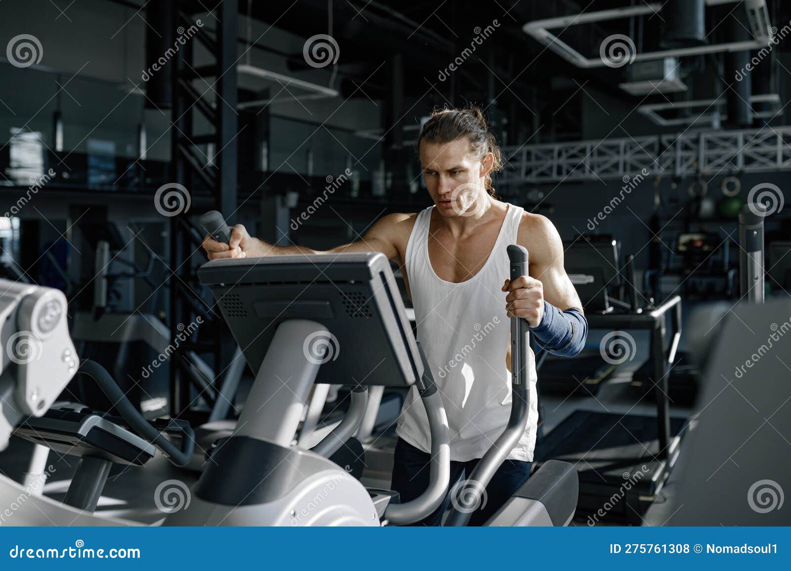 Sweaty Sportsman Doing Cardio Exercise on Orbitrack Training Apparatus ...