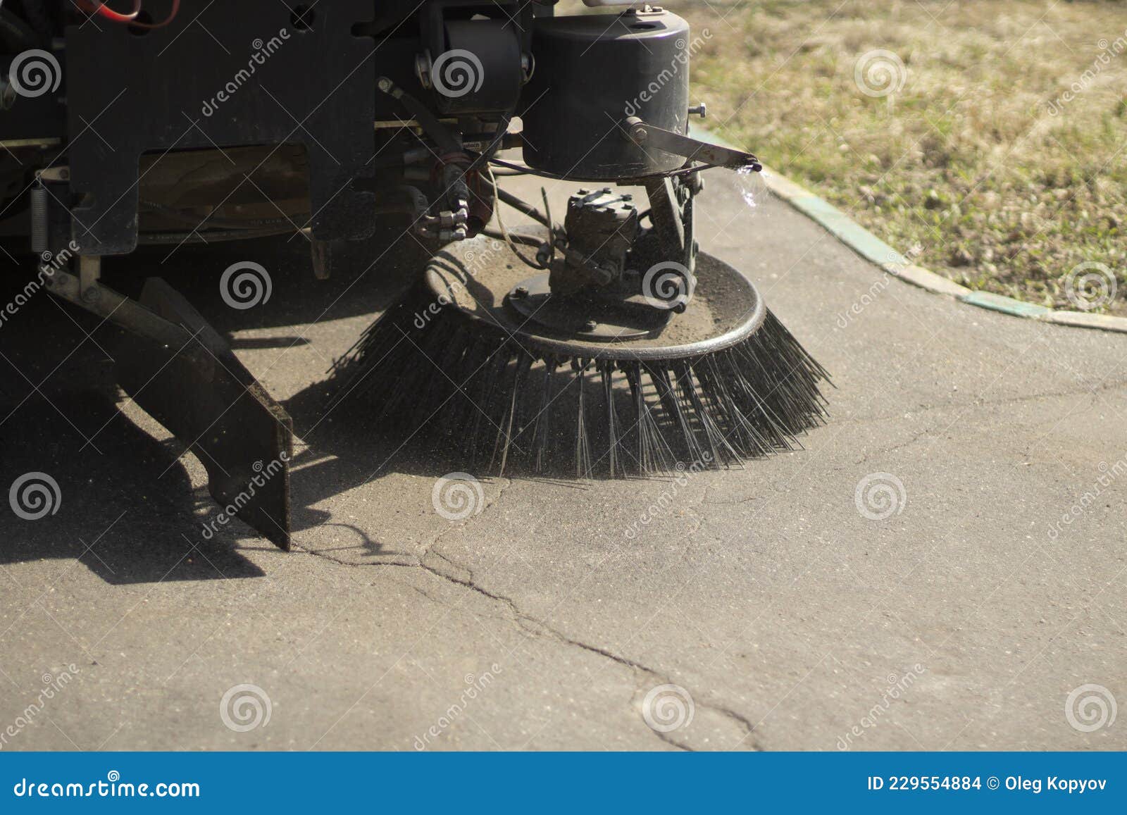 The Sweeper is Sweeping the Asphalt. Cleaning the Path with a Cleaning ...