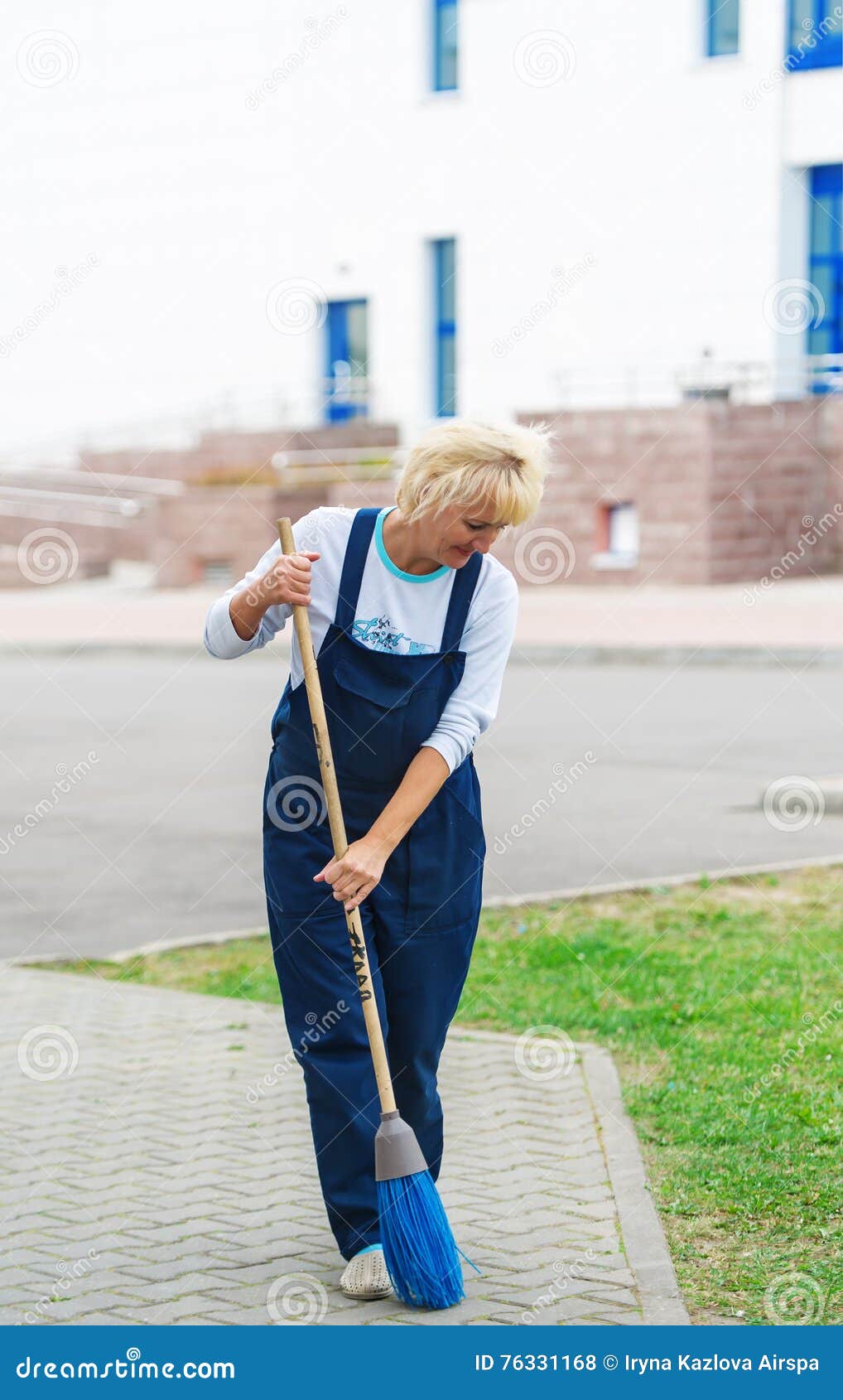 Sweeper Worker Cleaning City Street with Broom Tool. Stock Photo ...