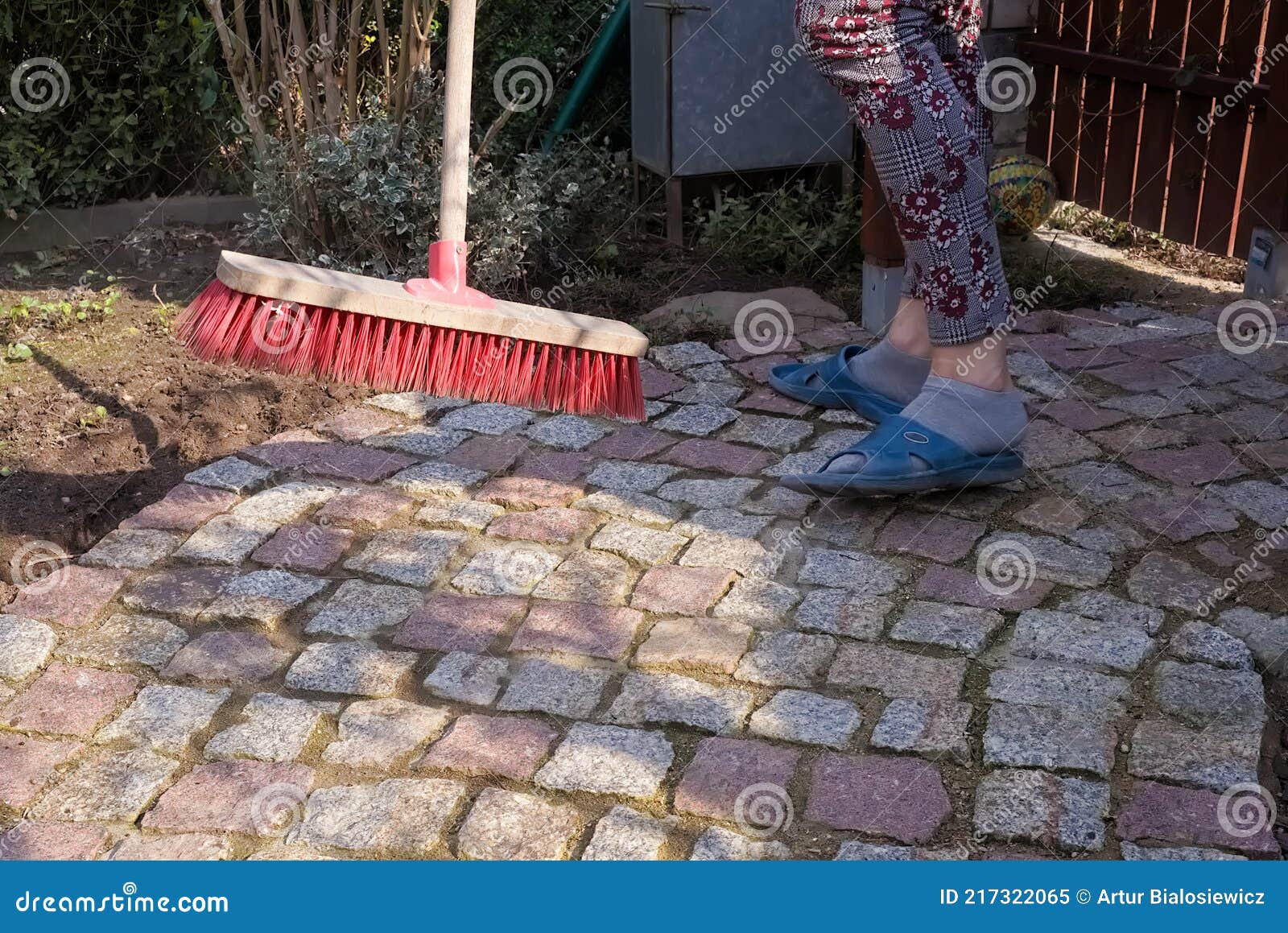 Sweeping a Granite Paving Path Stock Image - Image of garden, outdoors ...