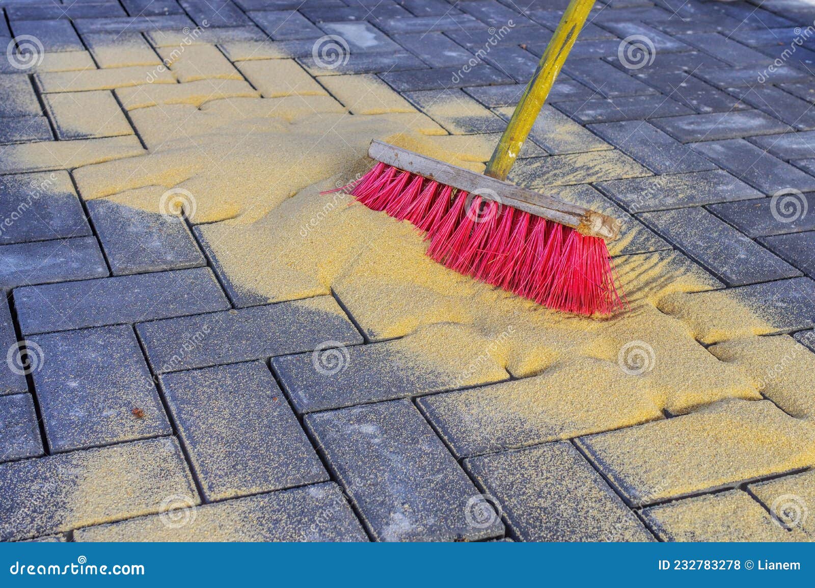 Sweeping in Joint Sand on Construction Site Stock Photo - Image of ...