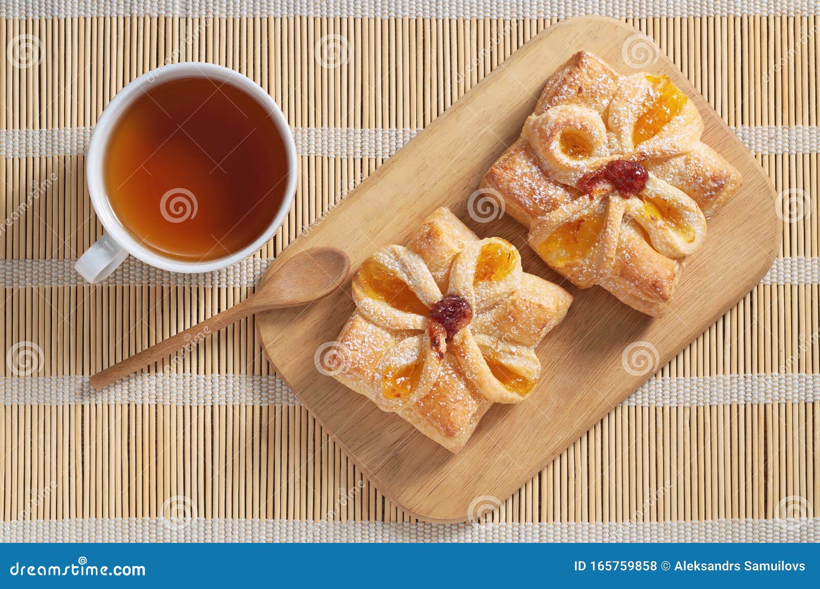 Sweet bun and tea stock photo. Image of powdered, delicious - 165759858