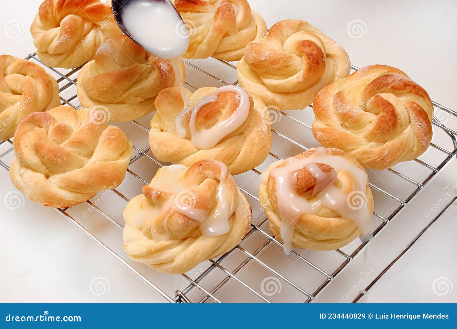 Sweet buns being decorated stock image. Image of plant - 234440829