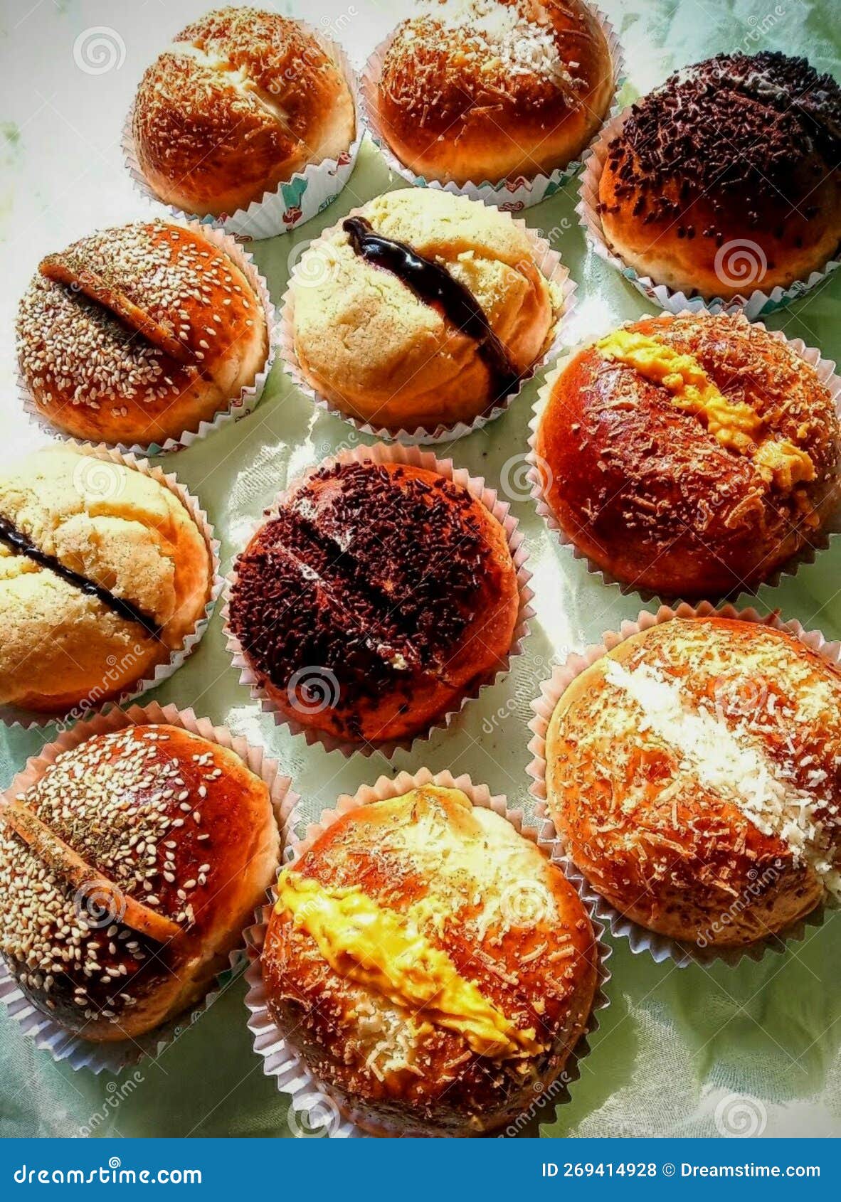 Sweet Buns with Various Fillings, Arranged on a Green Clothes, Ready ...