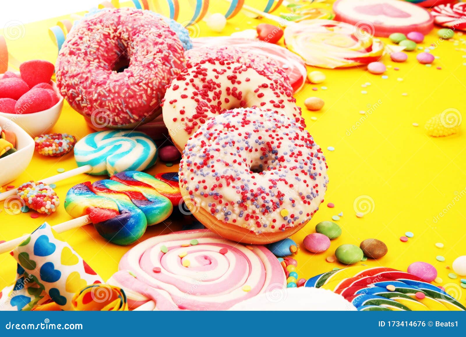 Sweet Carnival Donuts with Streamer and Confetti on Yellow Background ...