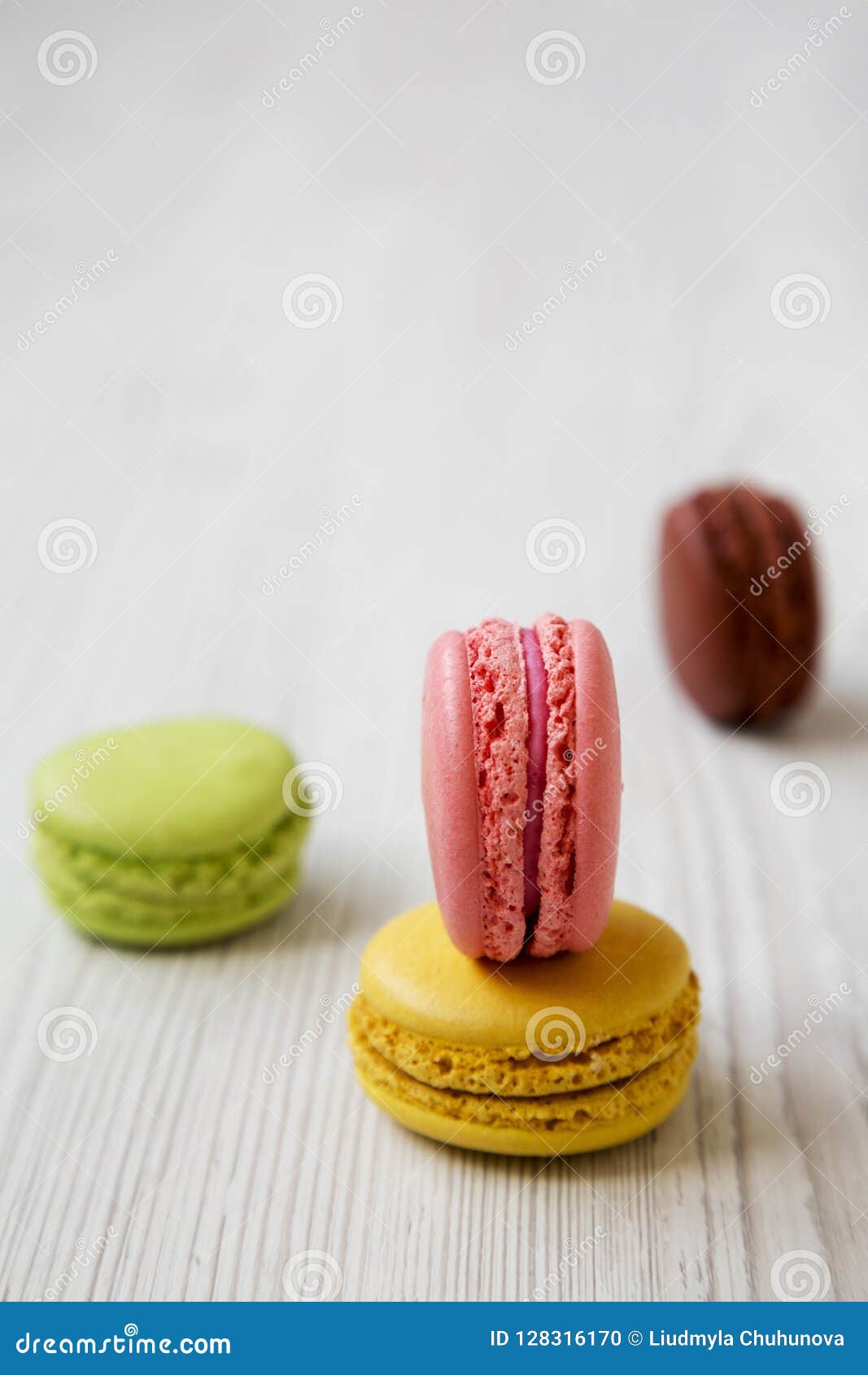 Sweet and Colorful Macarons on a White Wooden Table, Side View ...