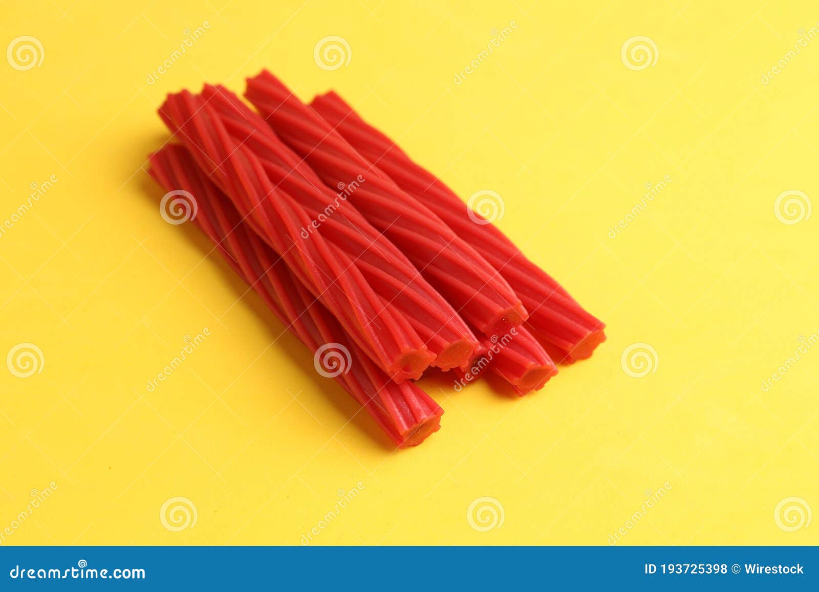 Sweet and Delicious Red Candies on the Yellow Surface Stock Photo ...
