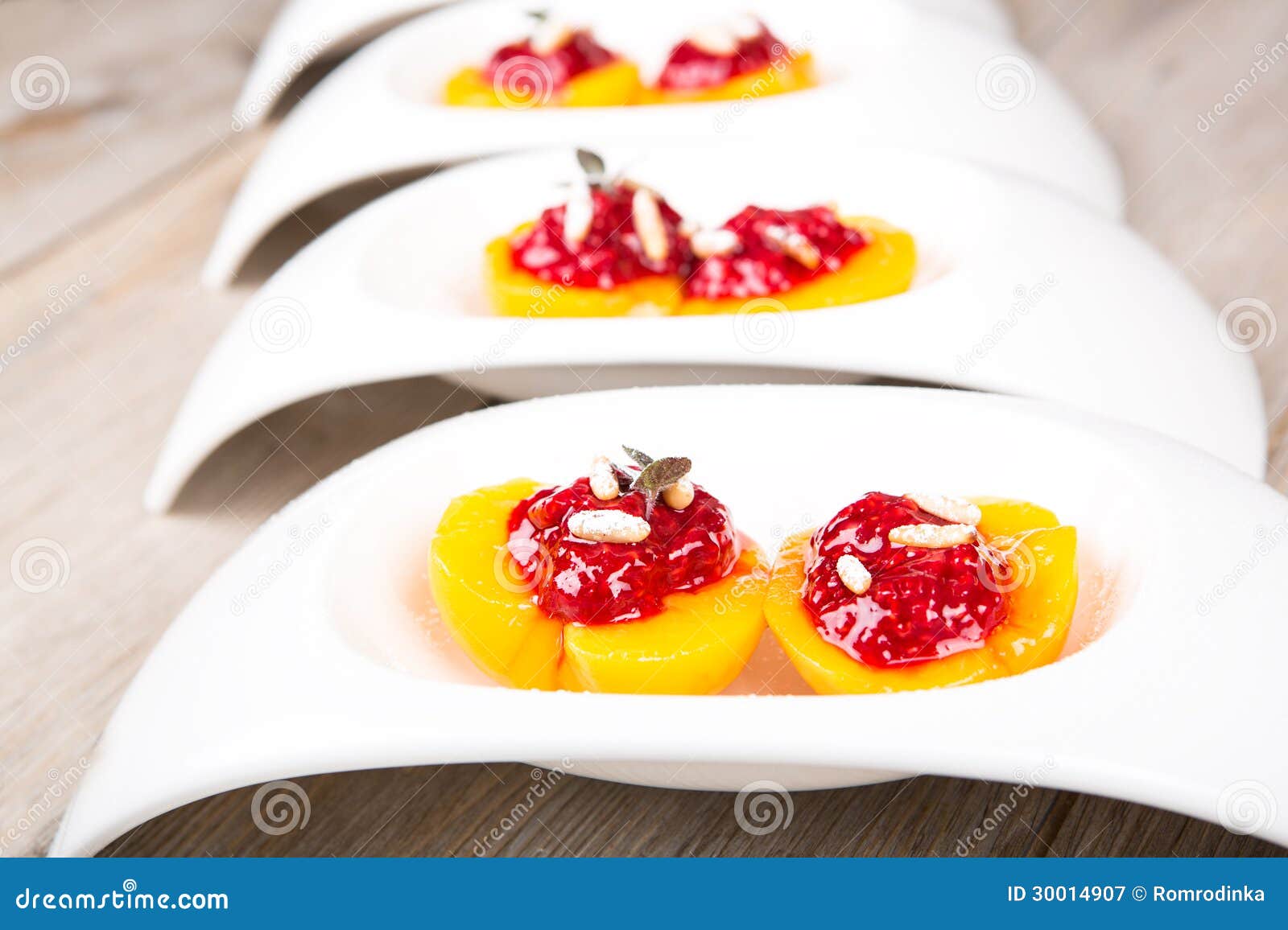 Sweet Dessert with Peaches Filled with Raspberry Puree Stock Image ...