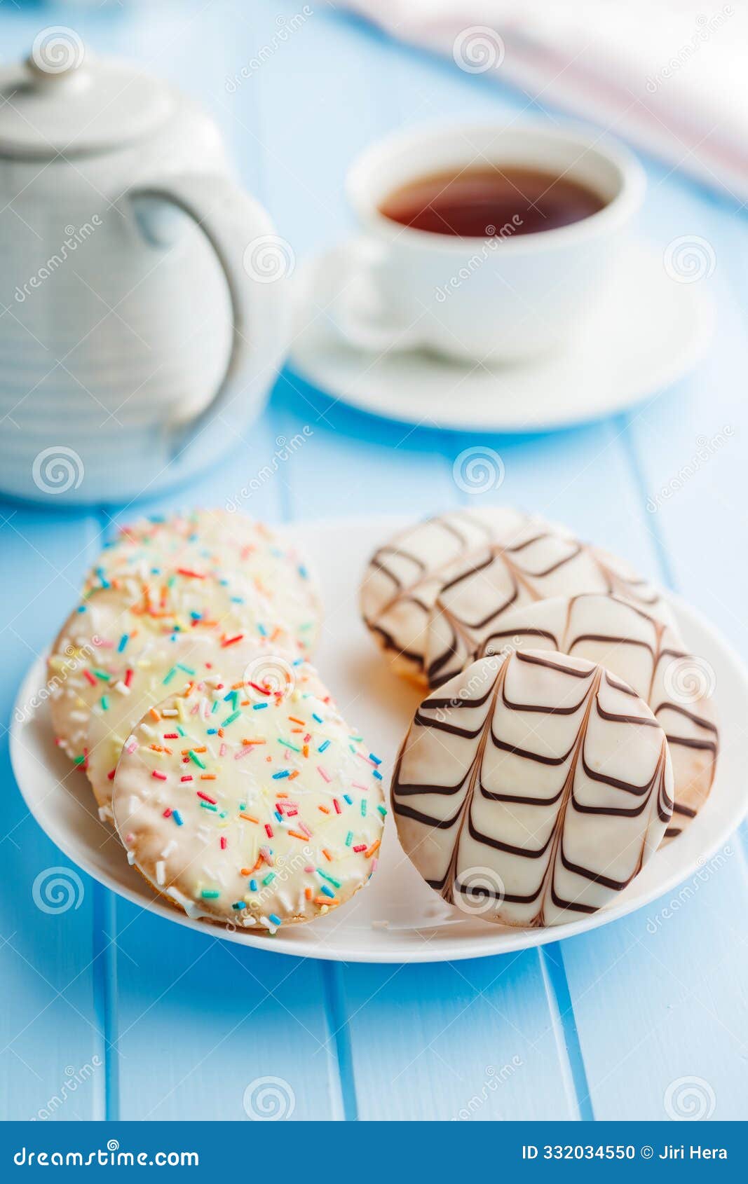 Sweet Dessert with Sugar Coating on Plate on Blue Table Stock Photo ...