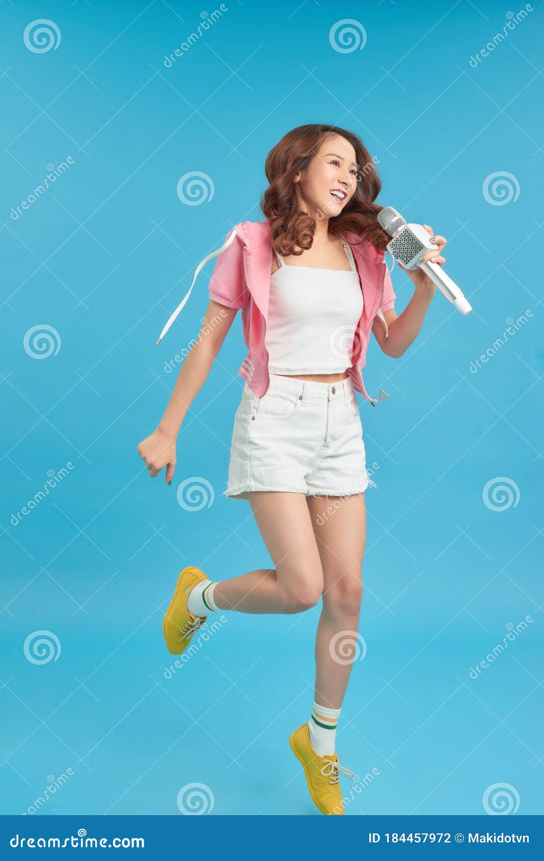 Sweet Girlfriend Holding Microphone Isolated on Blue Background Stock ...