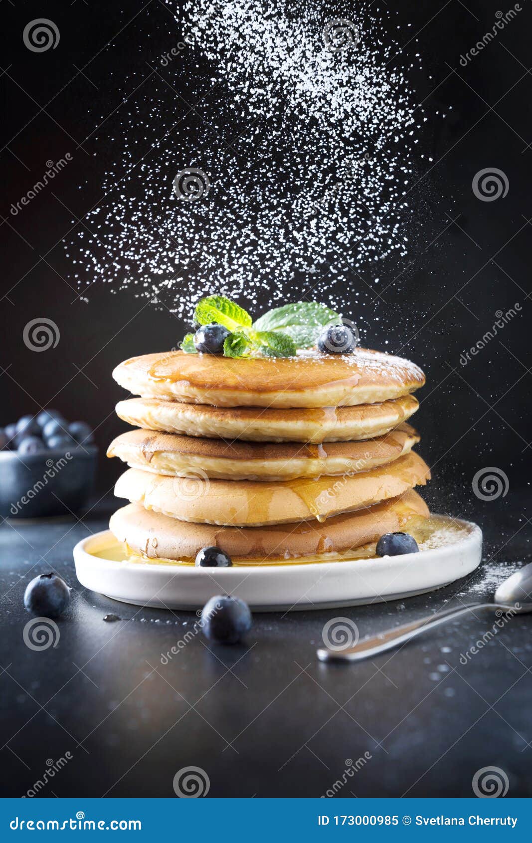 Sweet Homemade Stack of Pancakes with Powered Sugar on Black. Close Up ...
