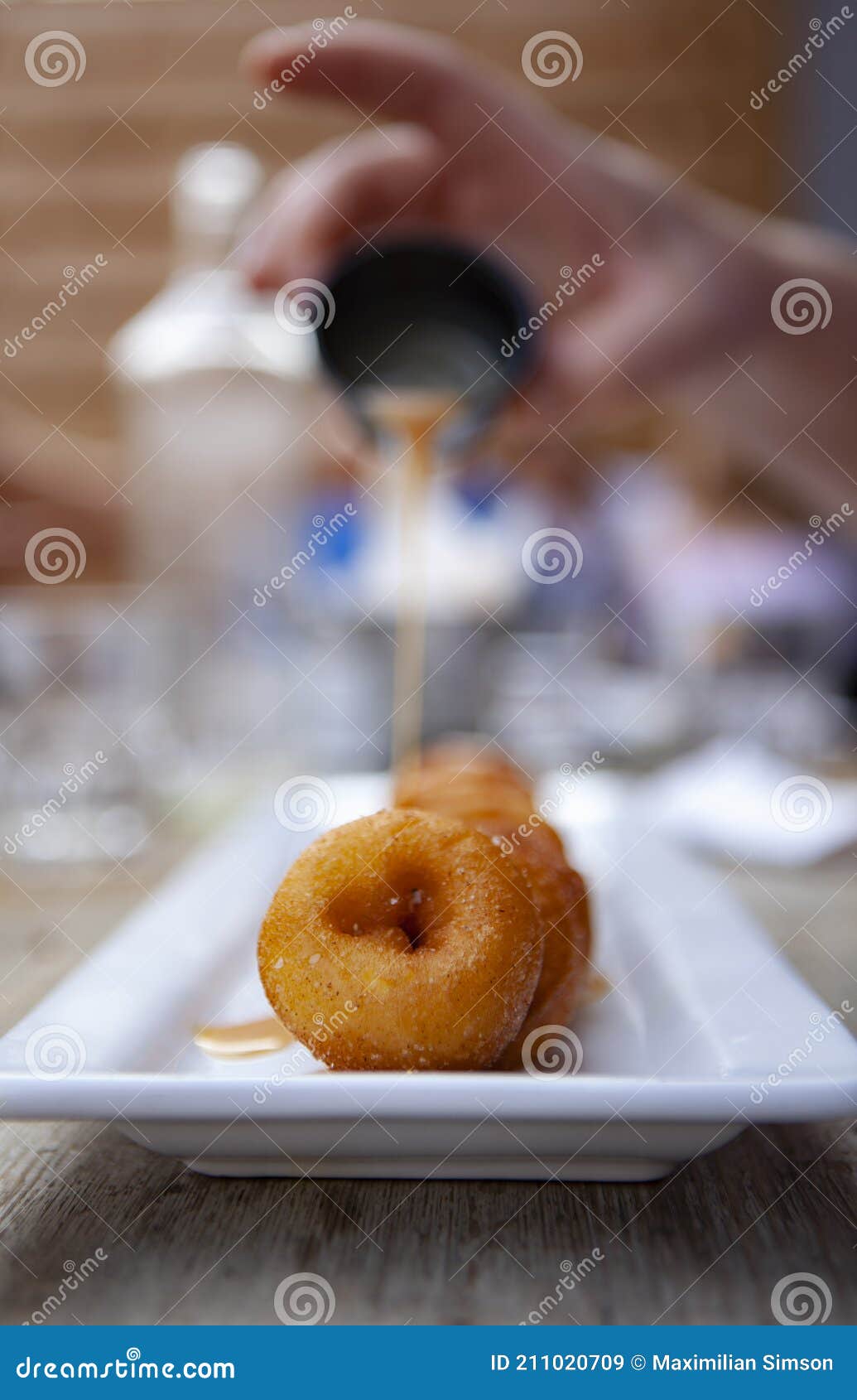 Sweet Mini Donuts on a White Tray with Maple Syrup and Loads of Sugar ...