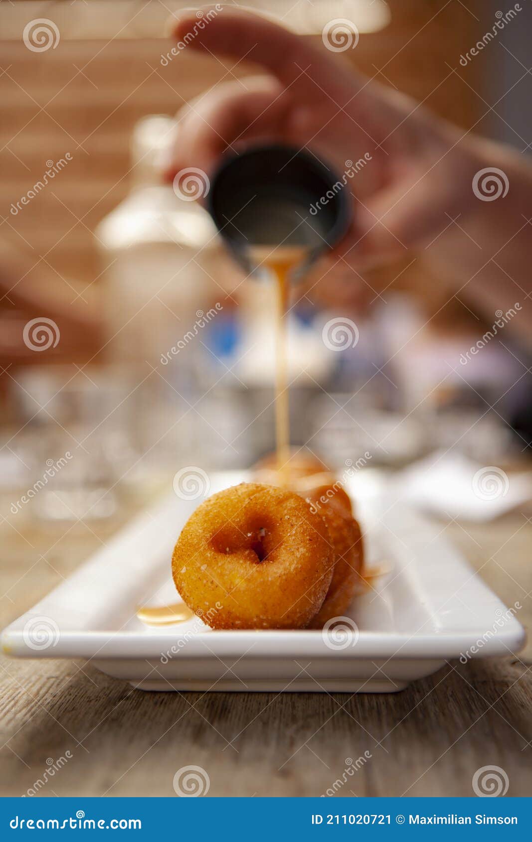 Sweet Mini Donuts on a White Tray with Maple Syrup and Loads of Sugar ...