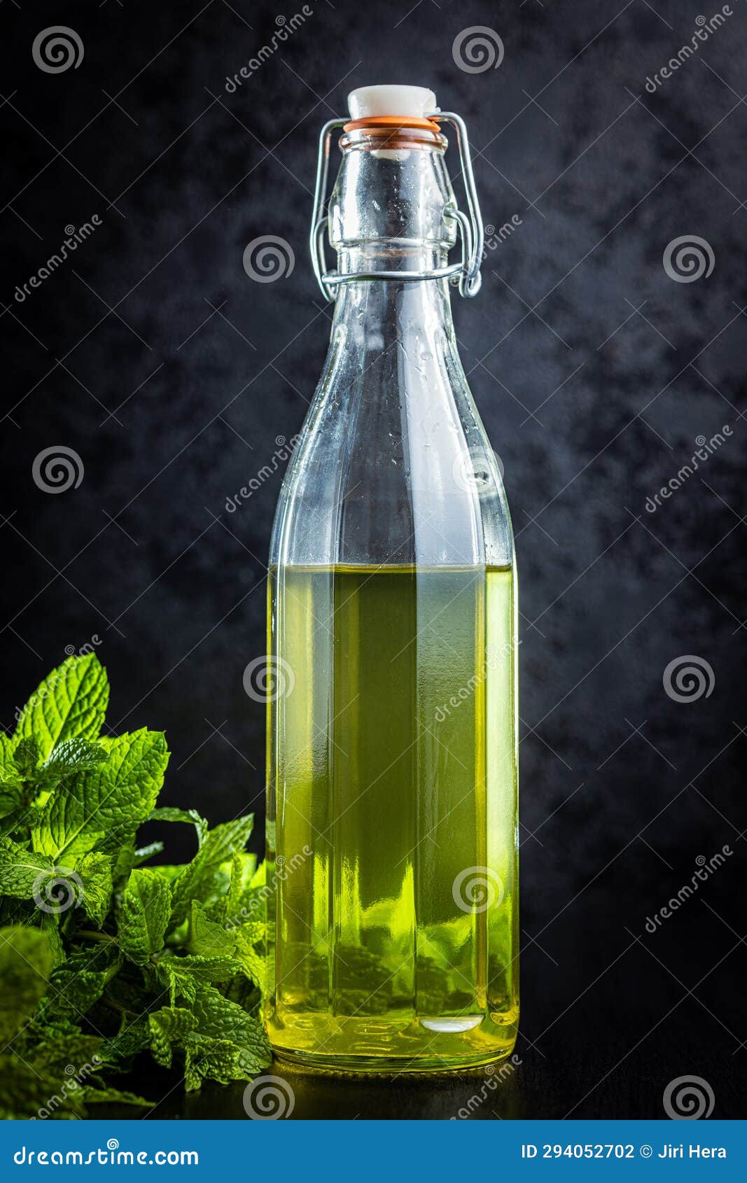 Sweet Mint Syrup and Mint Leaves on Black Table Stock Photo - Image of ...
