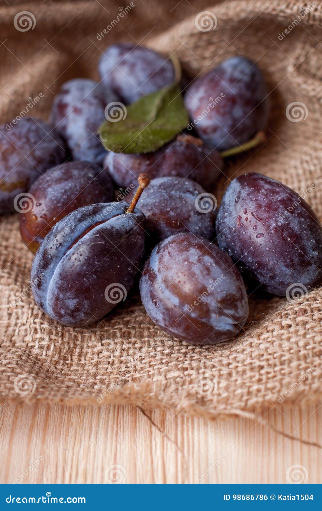 Sweet plums on pack cloth stock photo. Image of autumn - 98686786