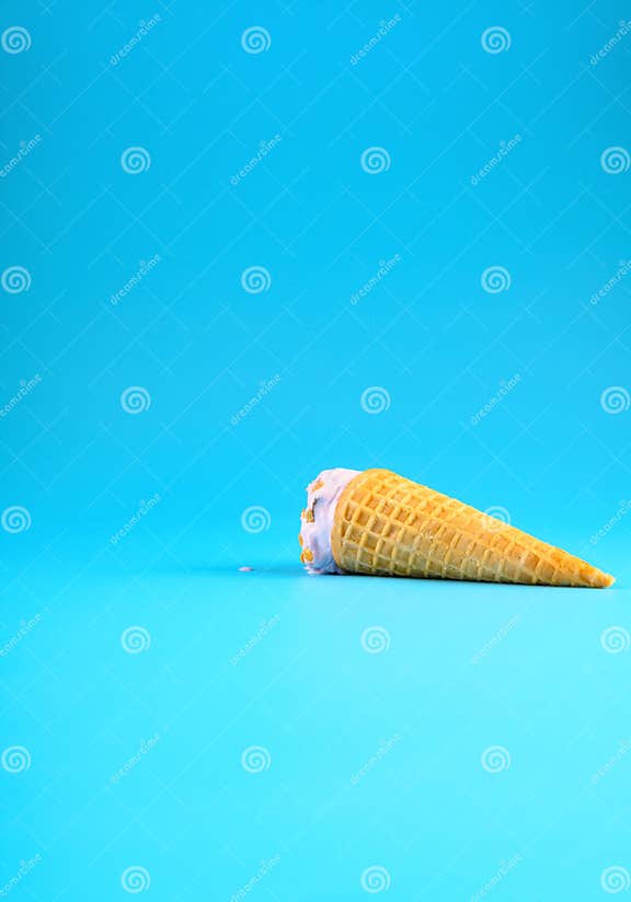 A Sweet Potato Flavor Ice Cream Cone In A Melting Process On Blue