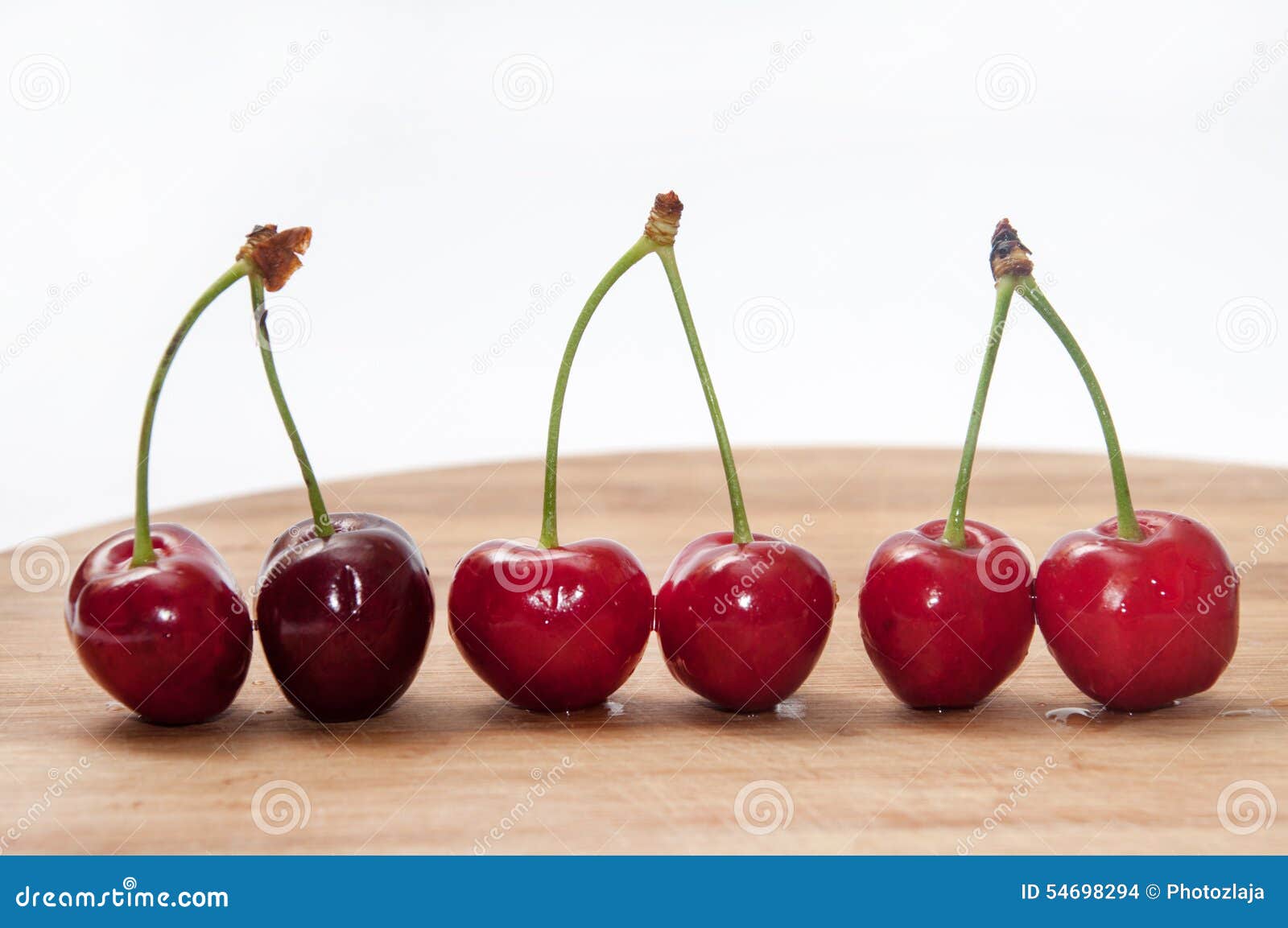 SWEET RED CHERRIES ROW WOODEN TABLE Stock Photo - Image of closeup ...