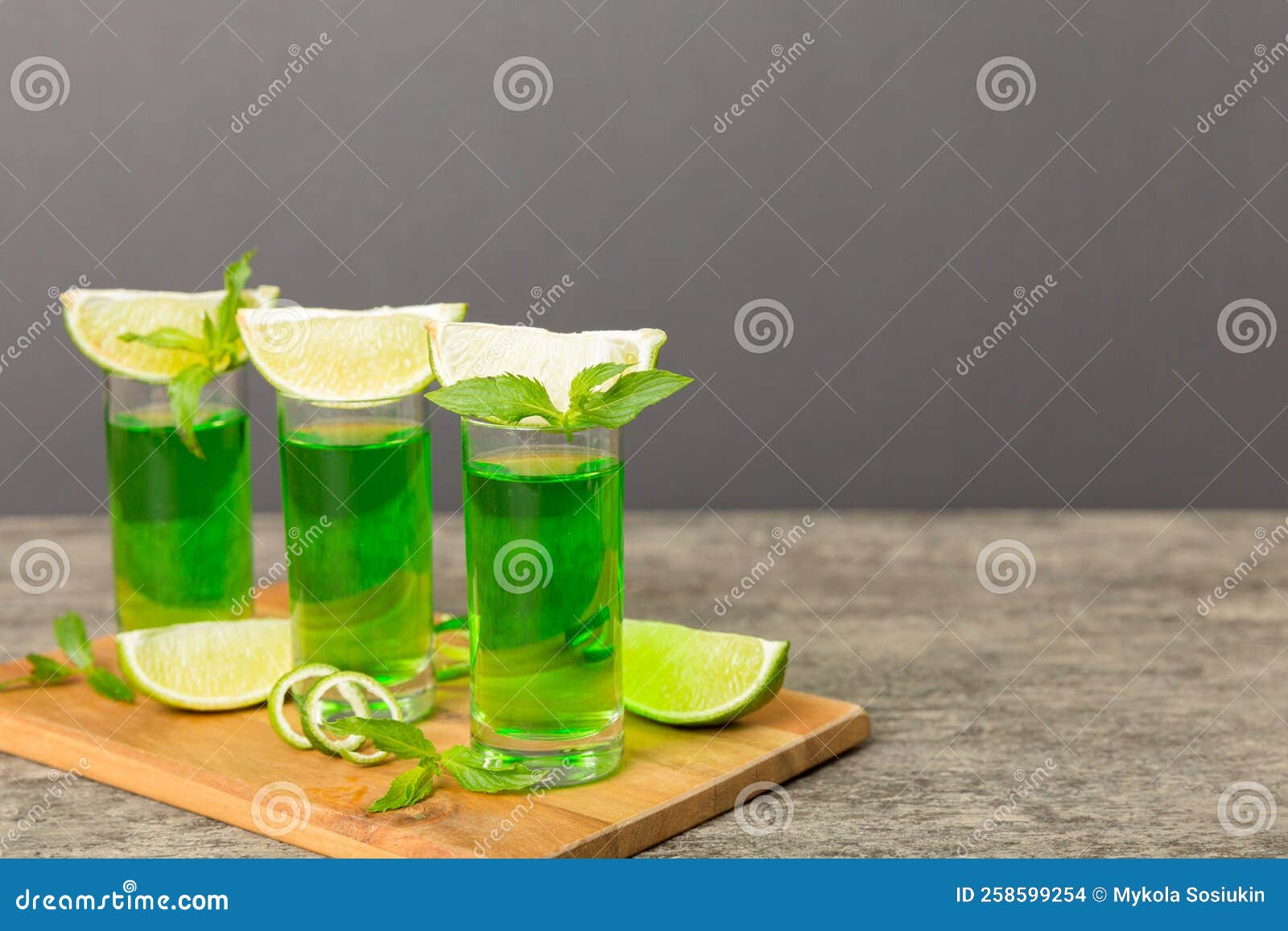 Sweet Refreshing Mint Liqueur, with Ice and Mint Leaves on Table ...