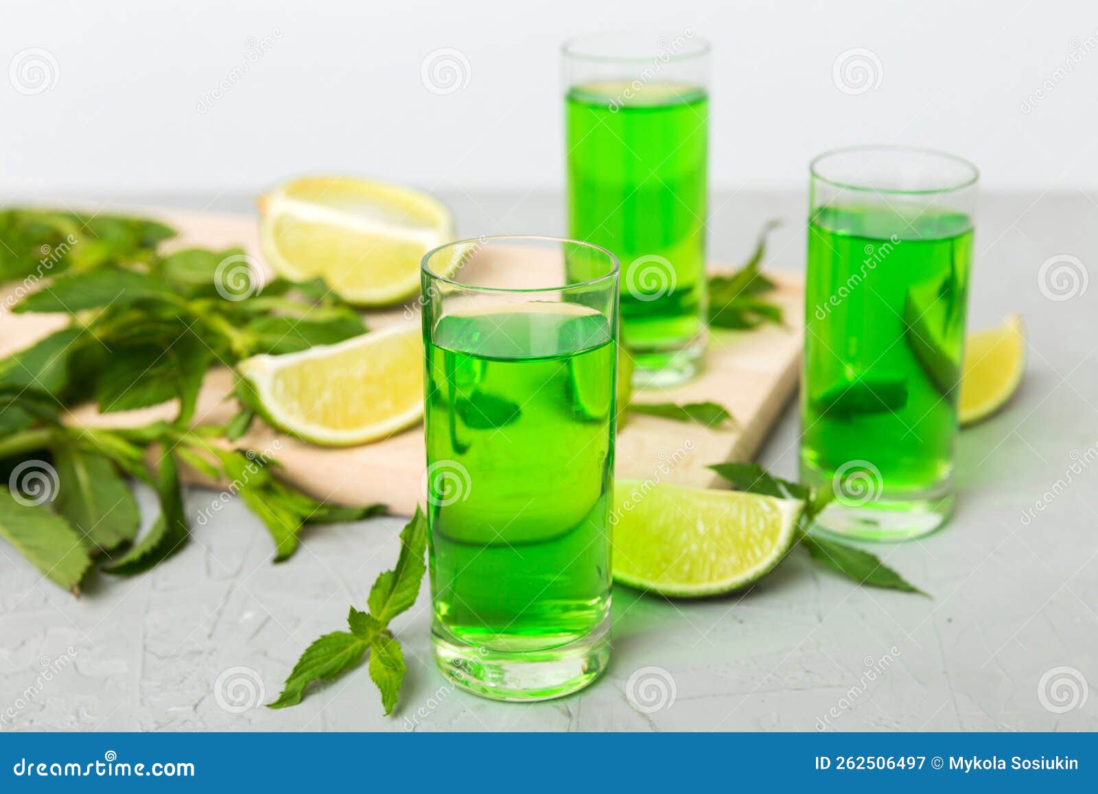 Sweet Refreshing Mint Liqueur, with Ice and Mint Leaves on Table ...