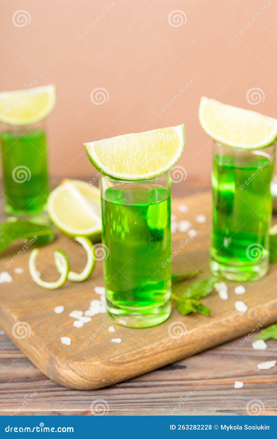 Sweet Refreshing Mint Liqueur, with Ice and Mint Leaves on Table ...