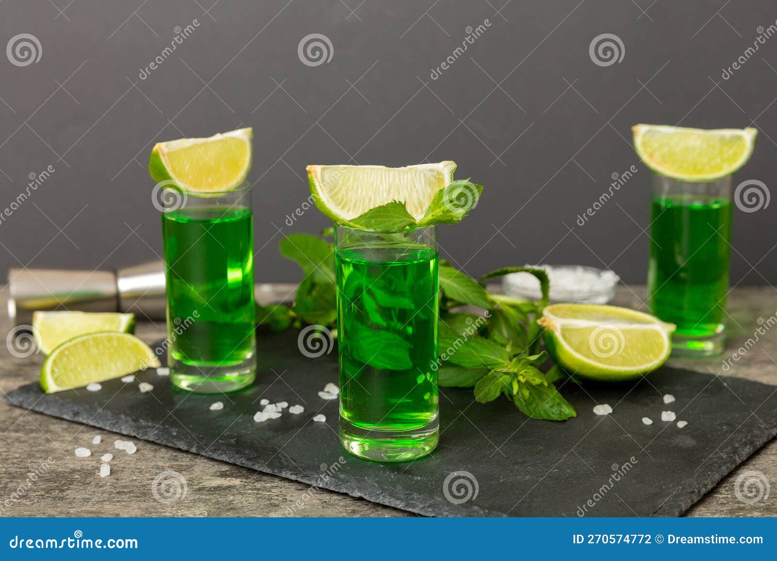 Sweet Refreshing Mint Liqueur, with Ice and Mint Leaves on Table ...