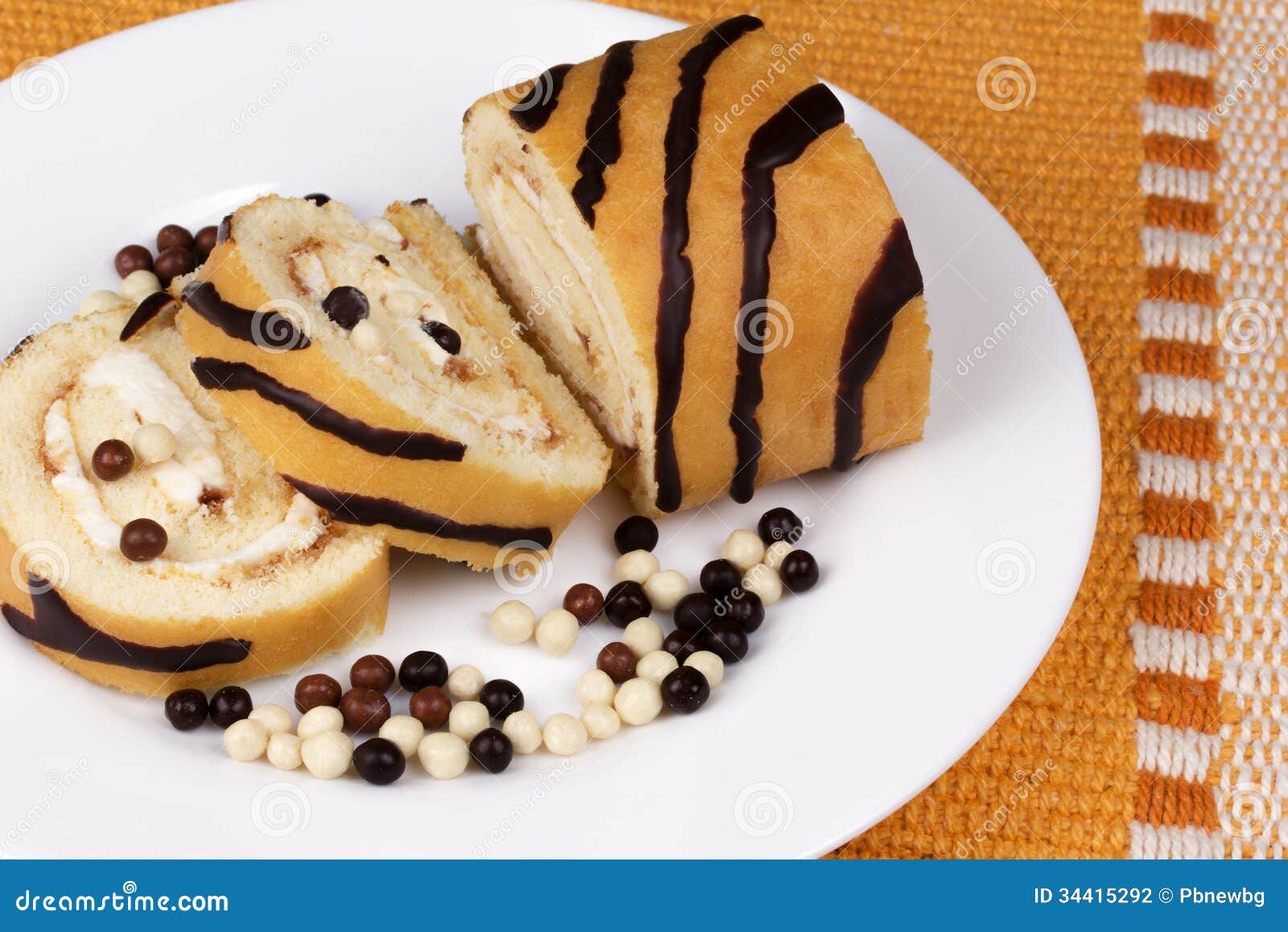 Sweet Roll with Chocolate Candies Stock Photo - Image of sponge, cake ...