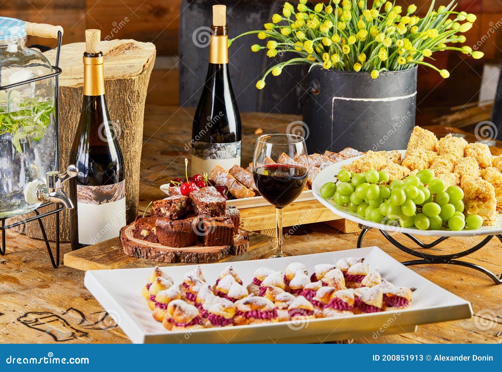 Sweet Table with a Selection of Cakes and Pastries with Grapes and Red ...