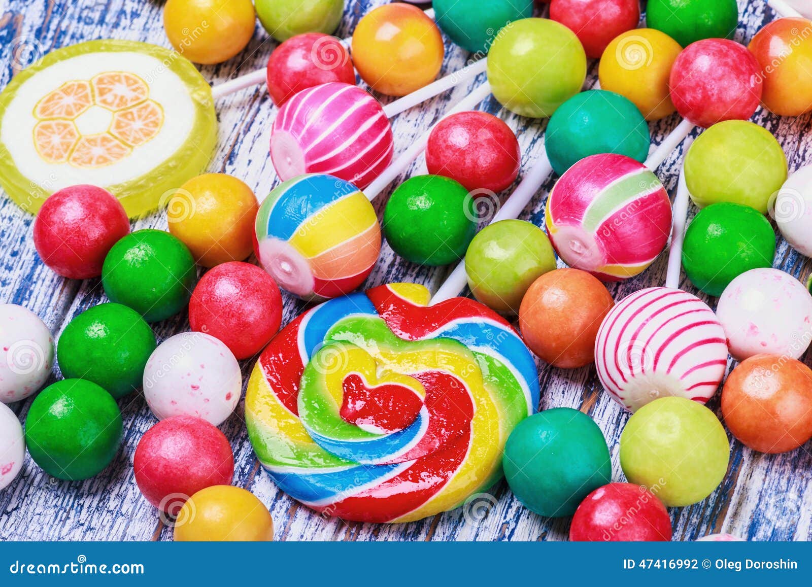 Sweets and Chewing Gum on a Wooden Table Stock Photo - Image of dessert ...